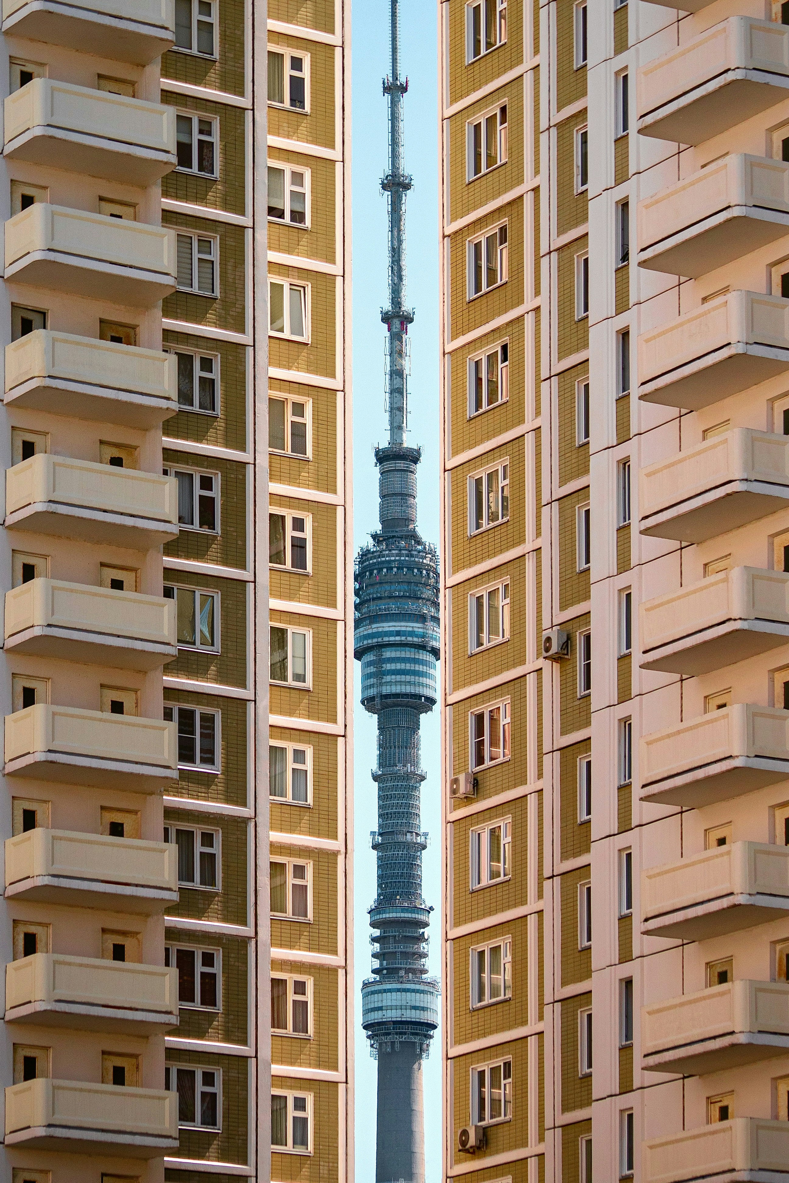 Between Beige Facades, a Steel Spire Framing the City