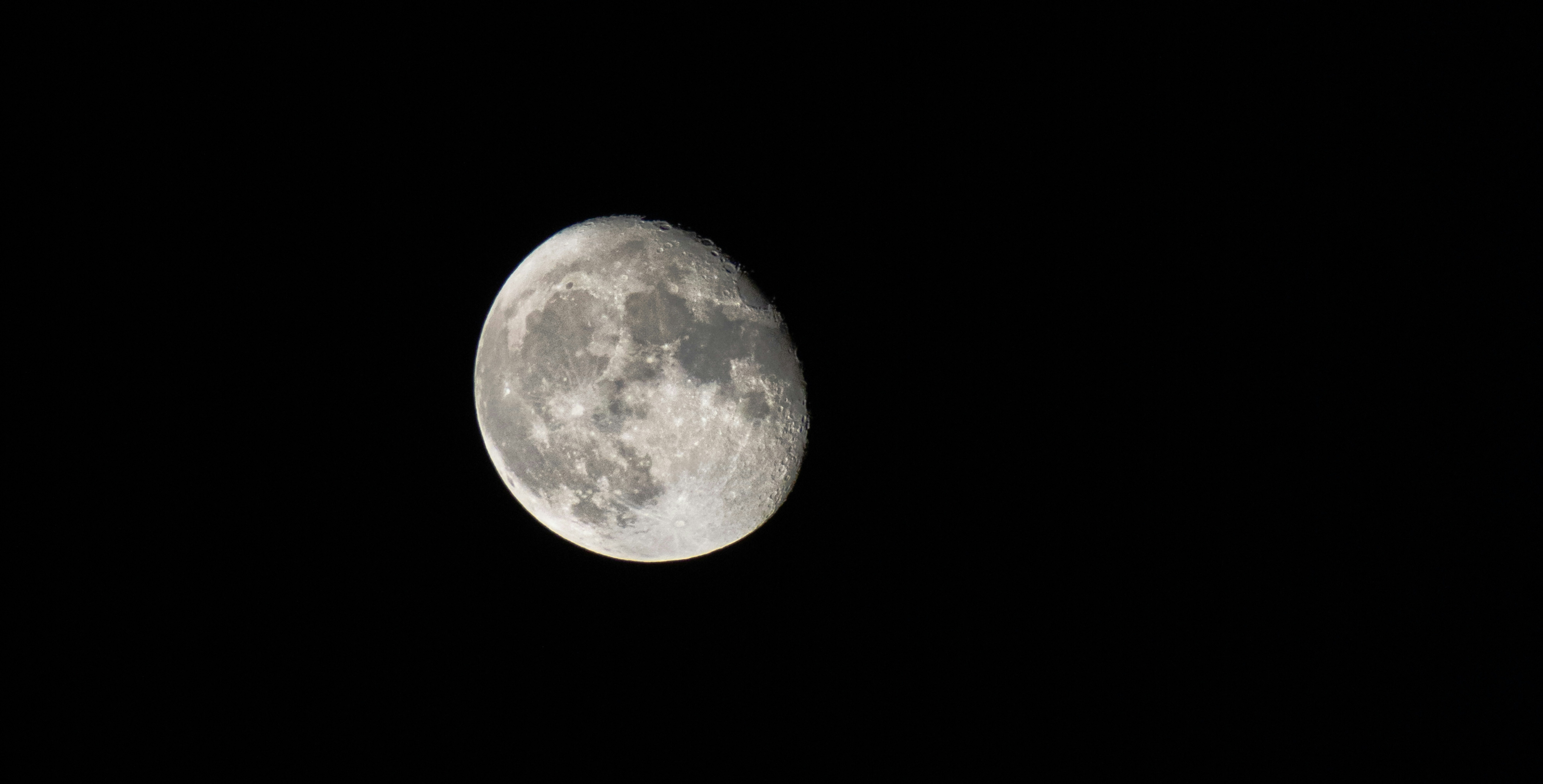 Detailed view of the moon set against a deep black sky.