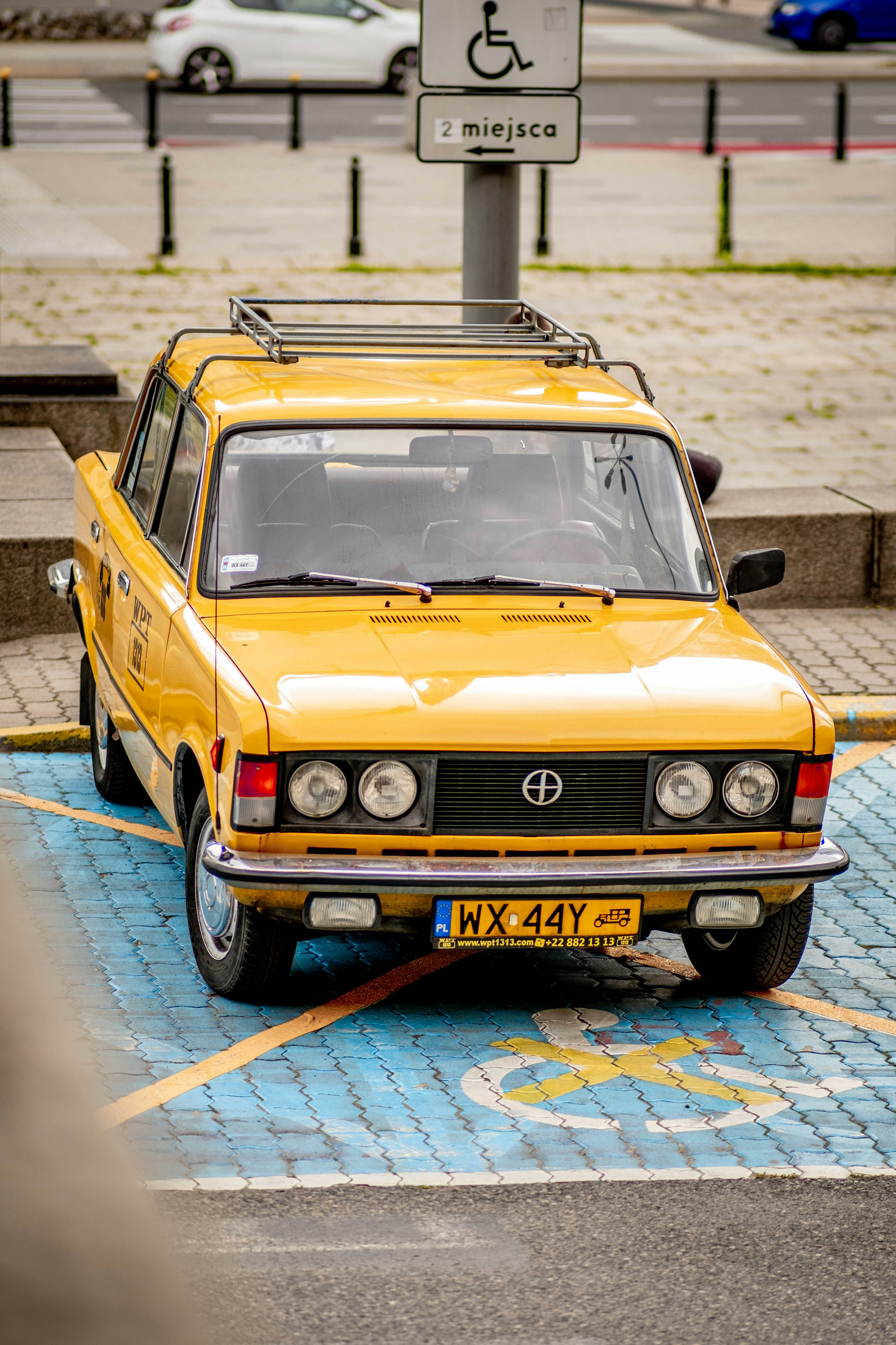 yellow and white car on road during daytime