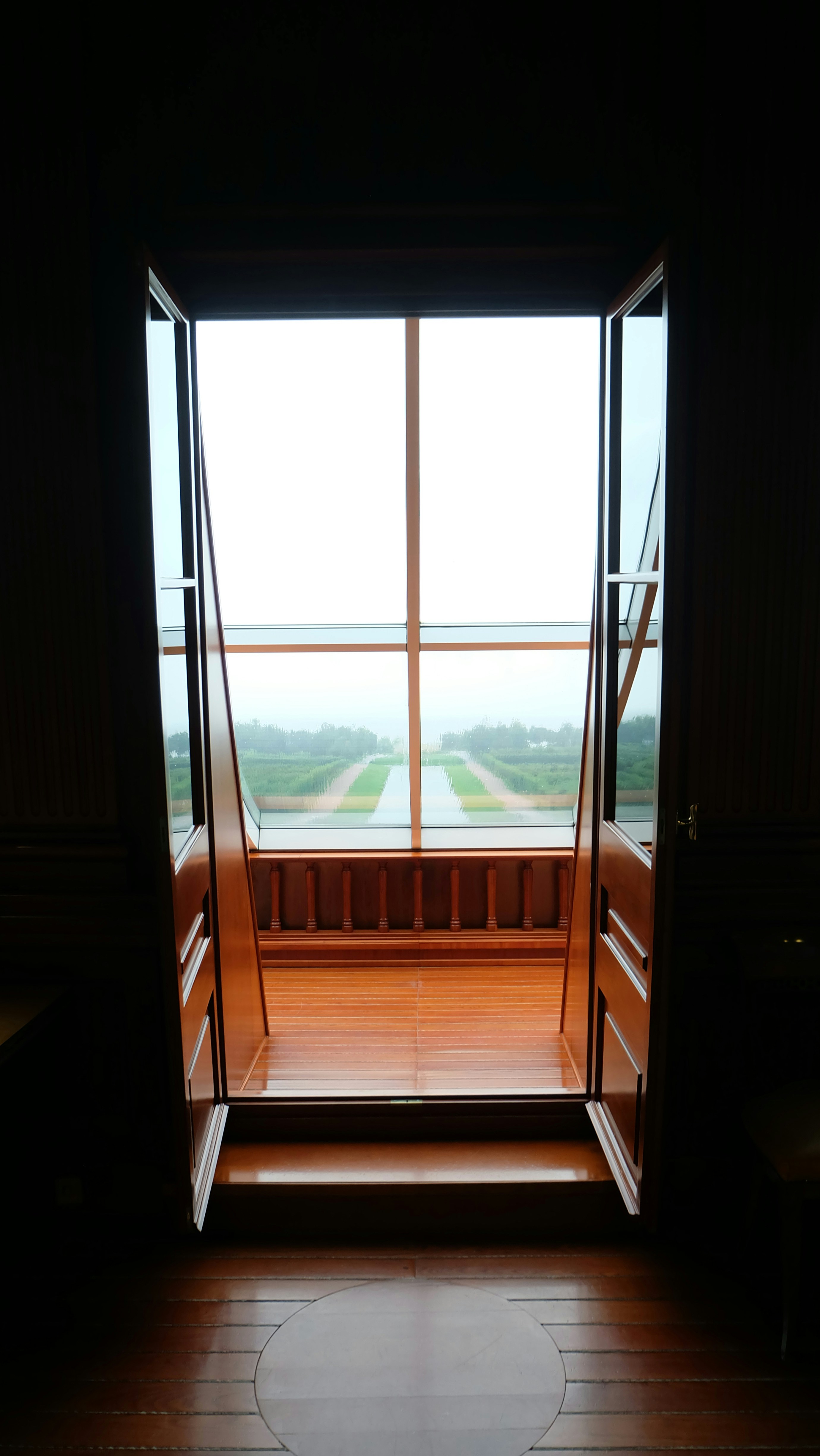 brown wooden framed glass window
