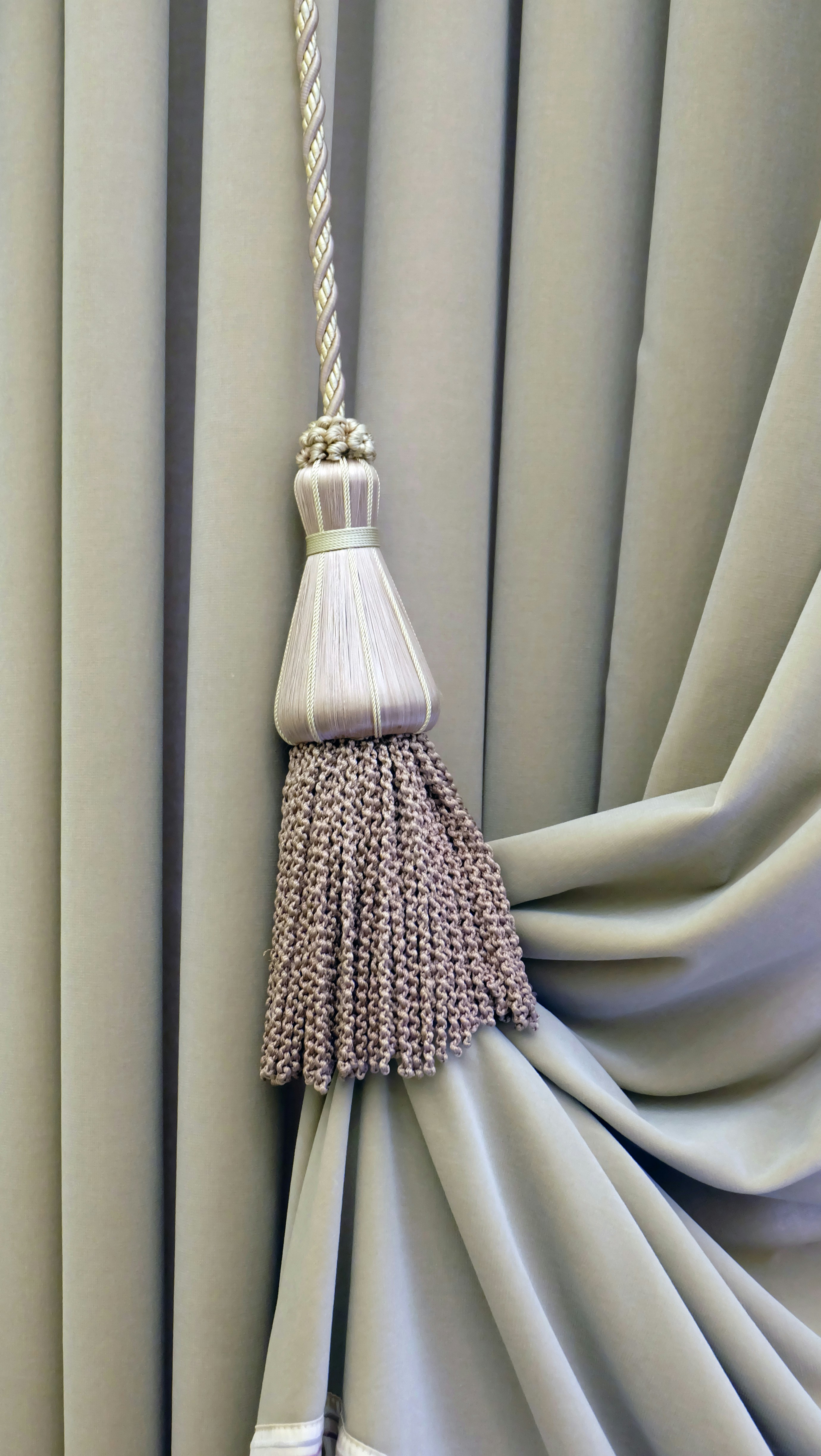 The Quiet Knot: Cream Tassel Anchoring Pale Draperies