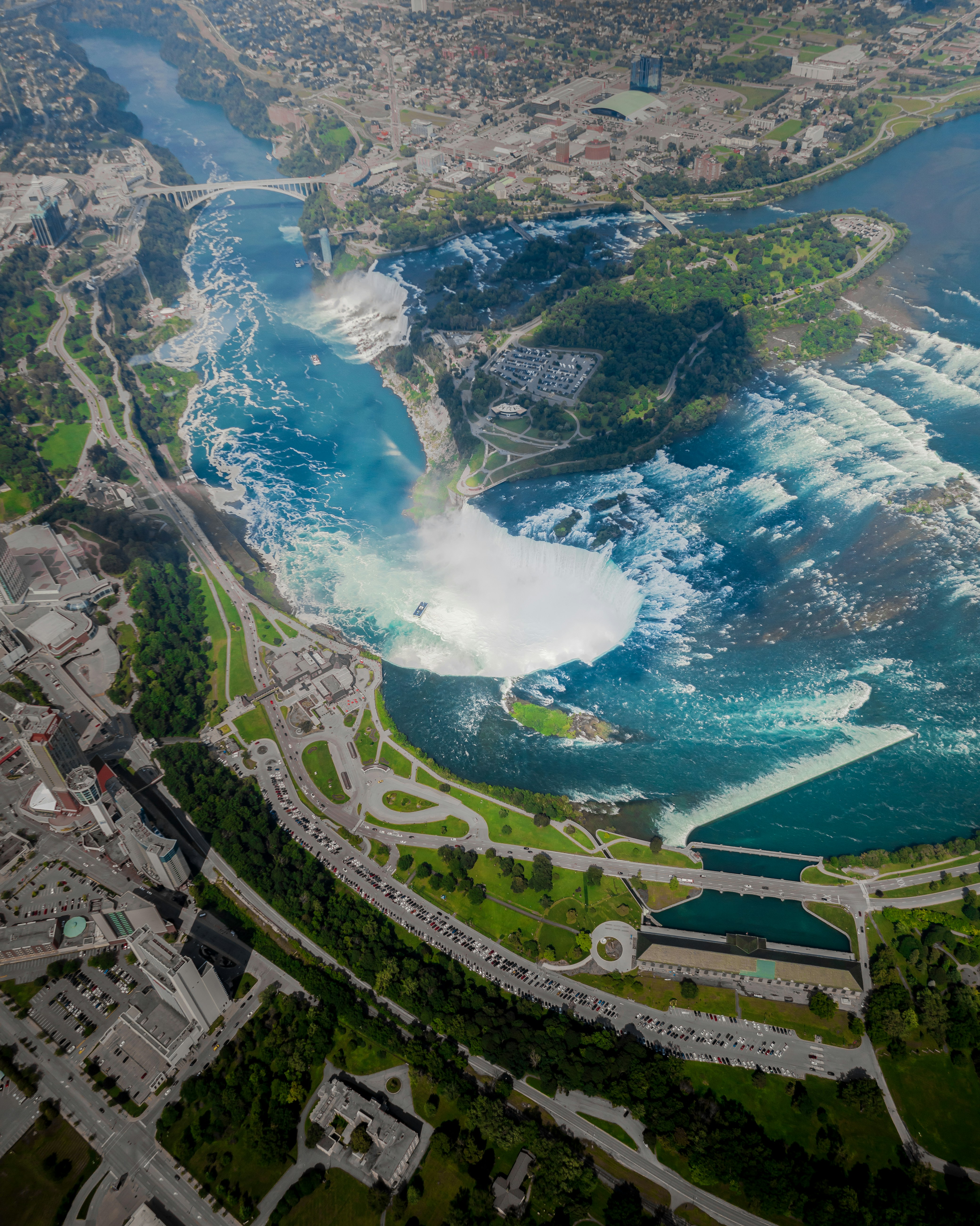 Aerial view of city buildings and green trees during daytime photo ...