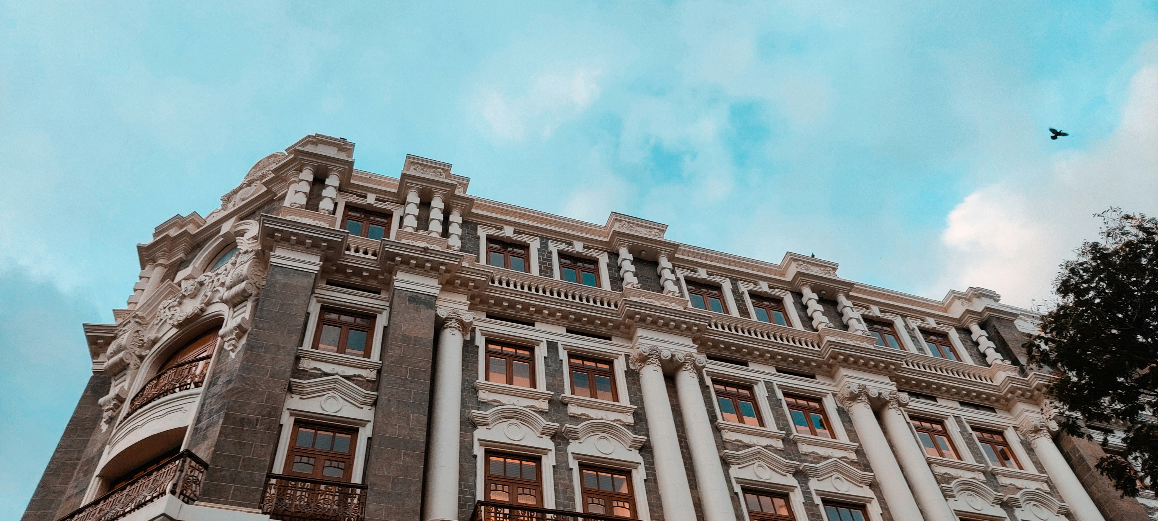 brown concrete building under blue sky during daytime