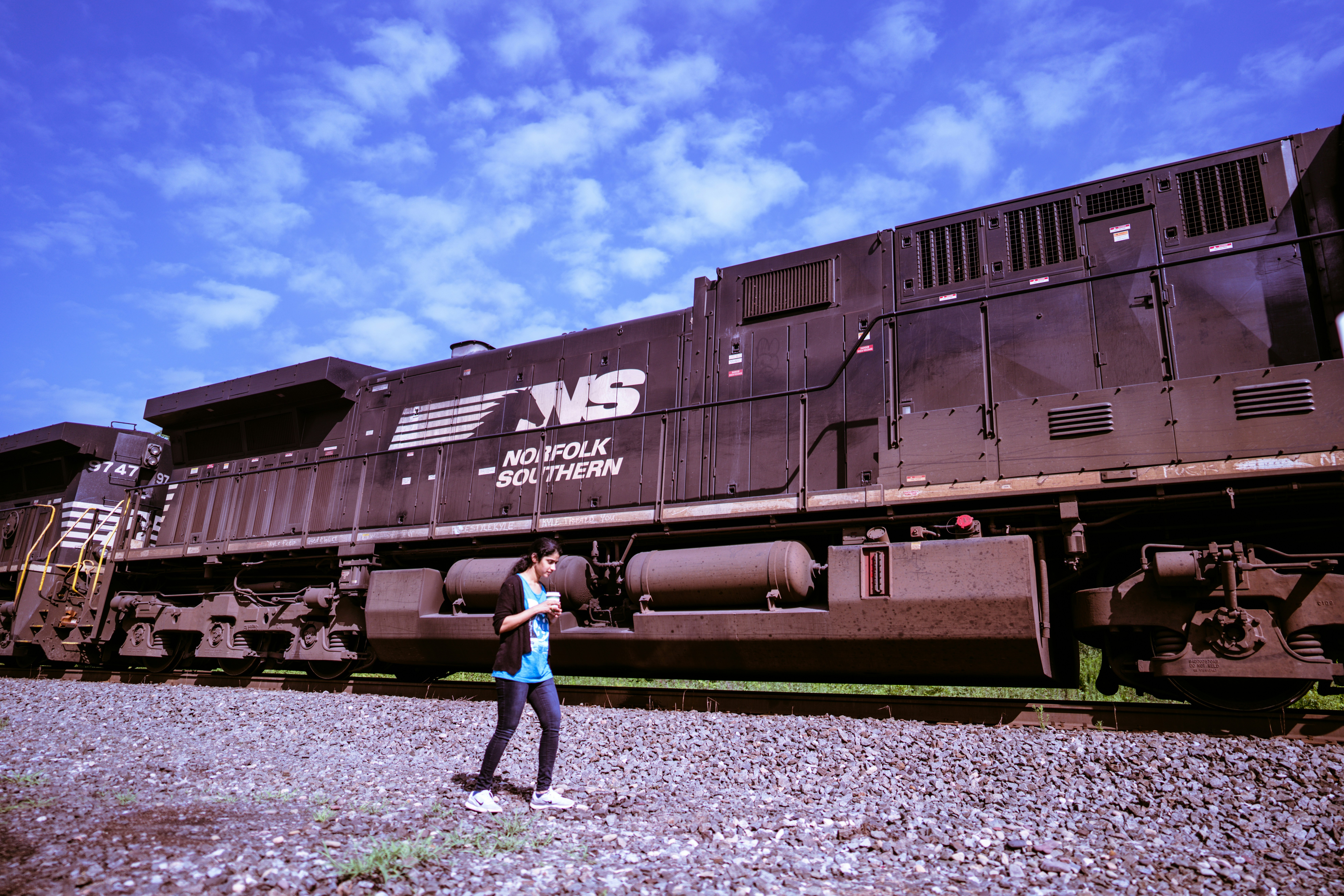 Stride Beside the Iron Colossus: A Runner and a Norfolk Southern Locomotive