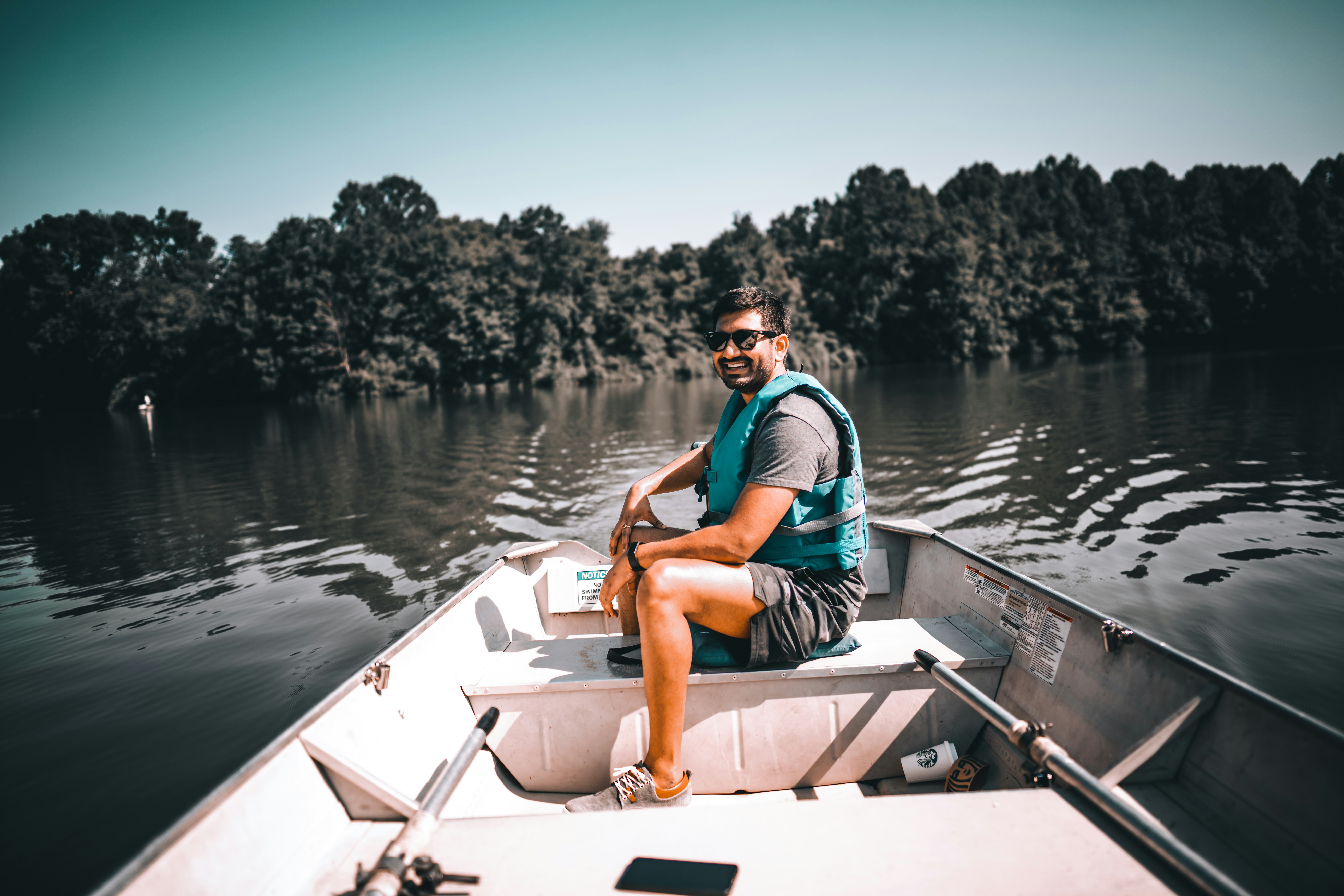 Rowing Outward: A Lone Angler in a Quiet Lake