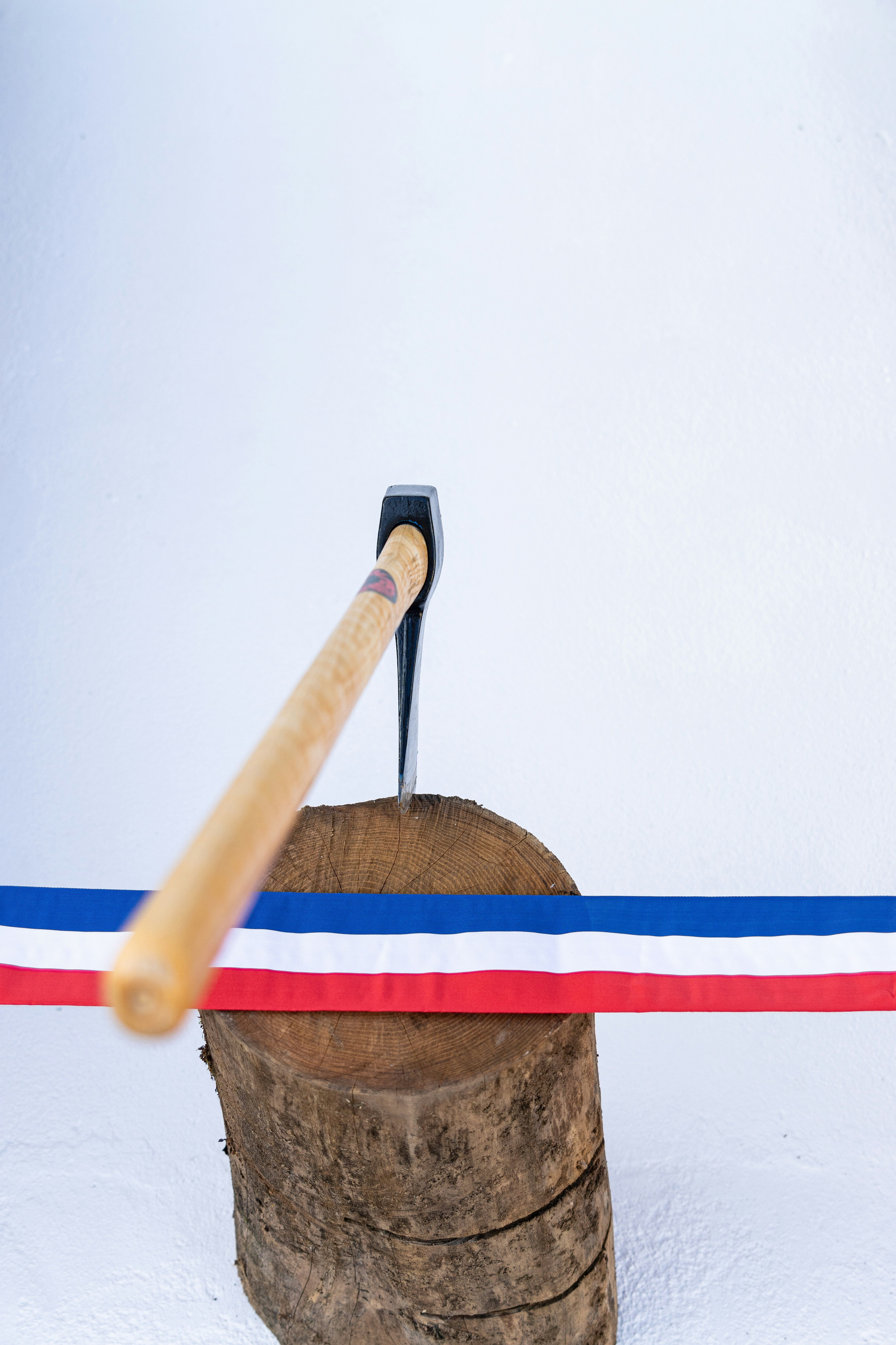 Close up on an axe and a french ribbon before an inauguration