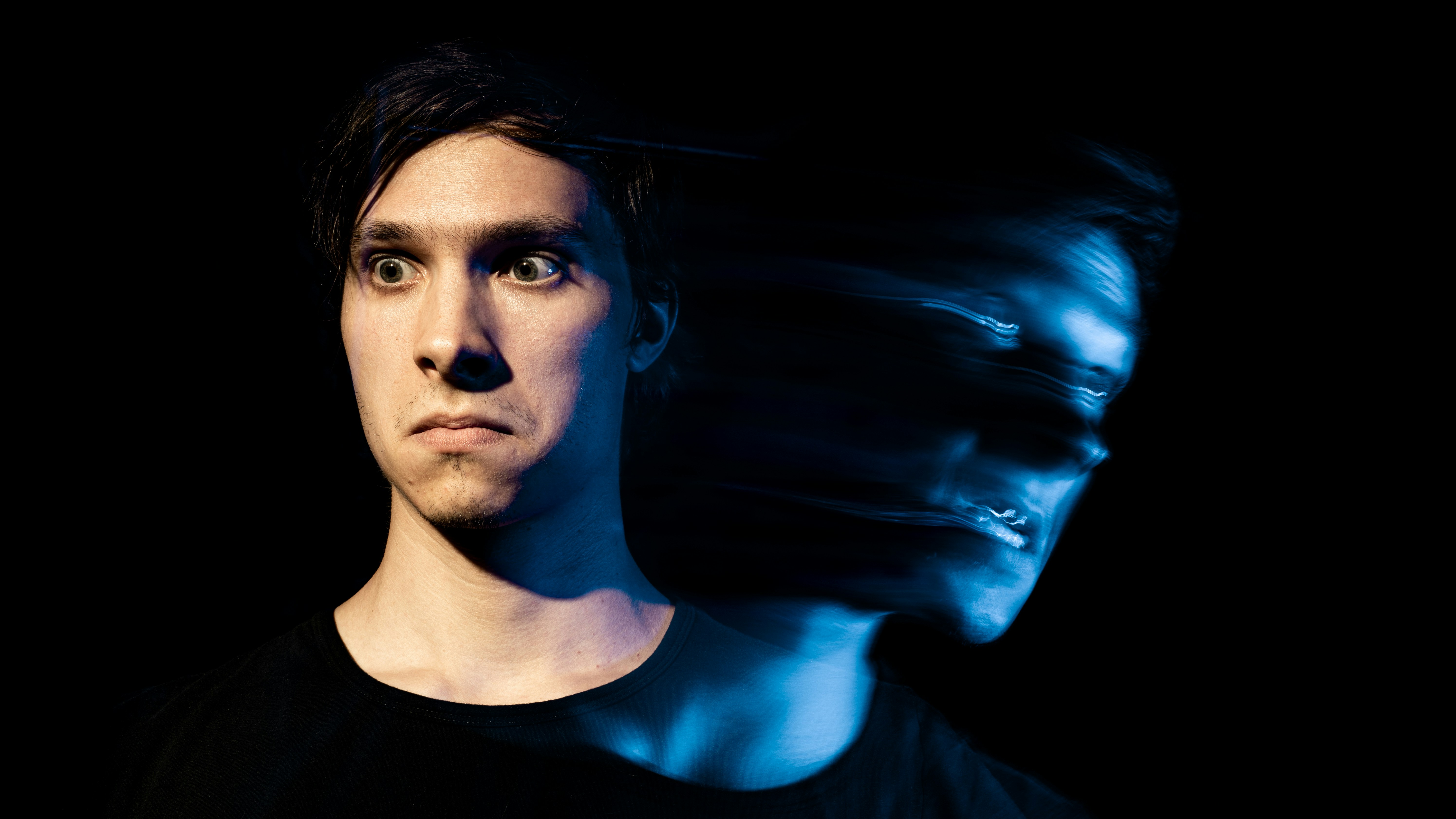 Centered Gaze Beneath a Shifting Aura