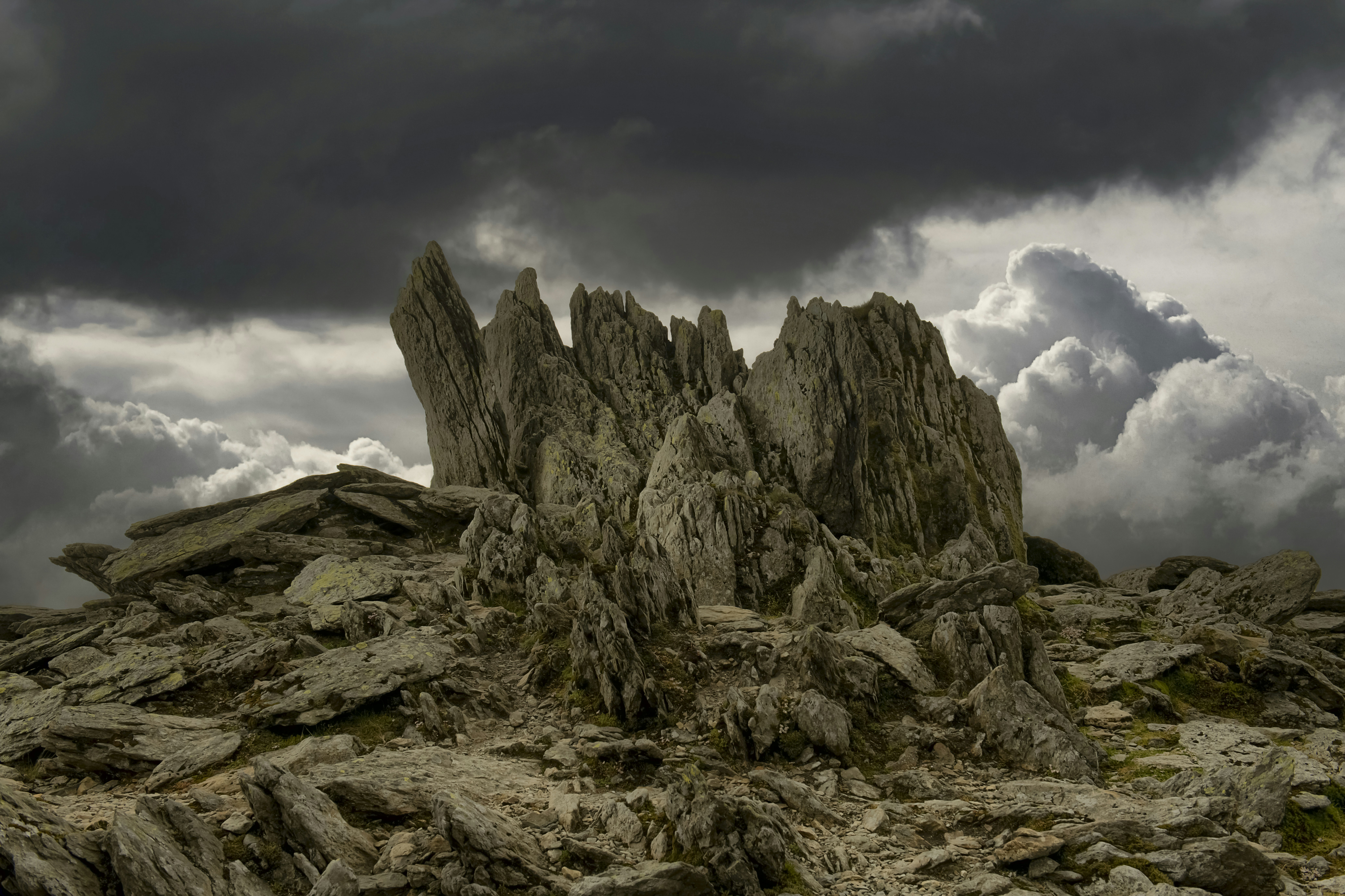 Gray rocky mountain under cloudy sky during daytime photo – Free Cloud ...