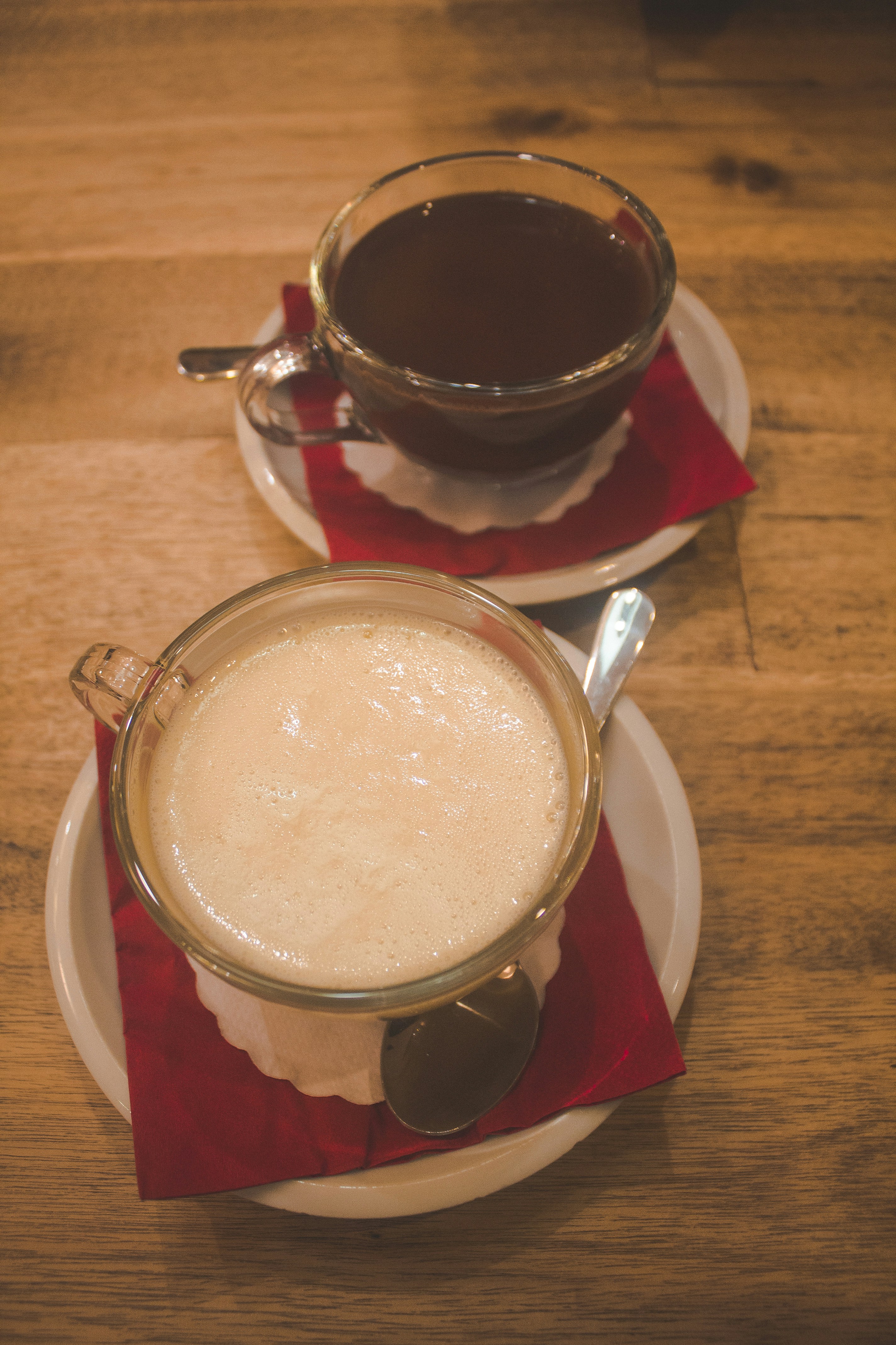 clear glass mug with brown liquid