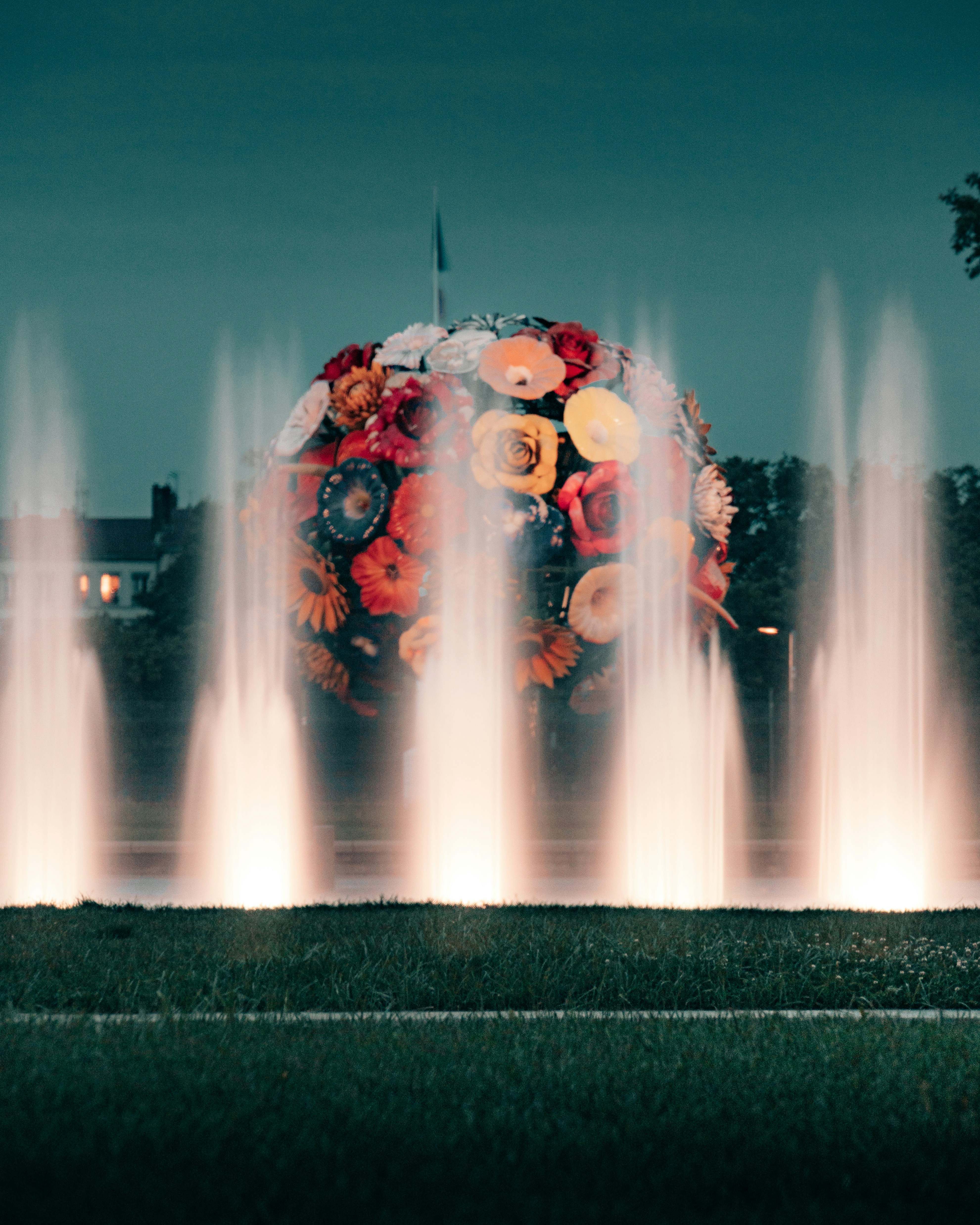 Floating Floral Sphere: A Fountain Backdrop in Bloom