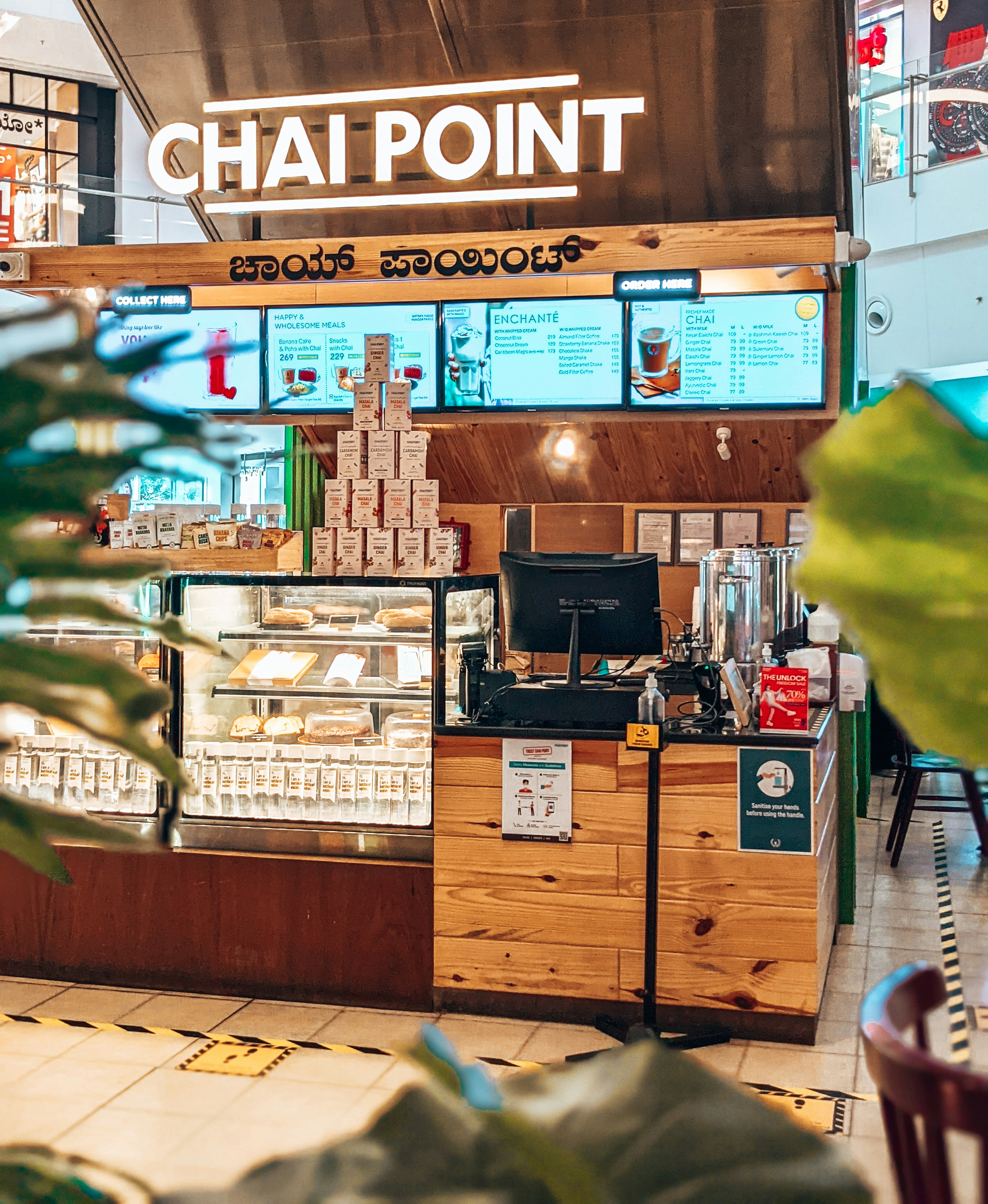 Chai Point Neon Sign Over a Mall Café Counter