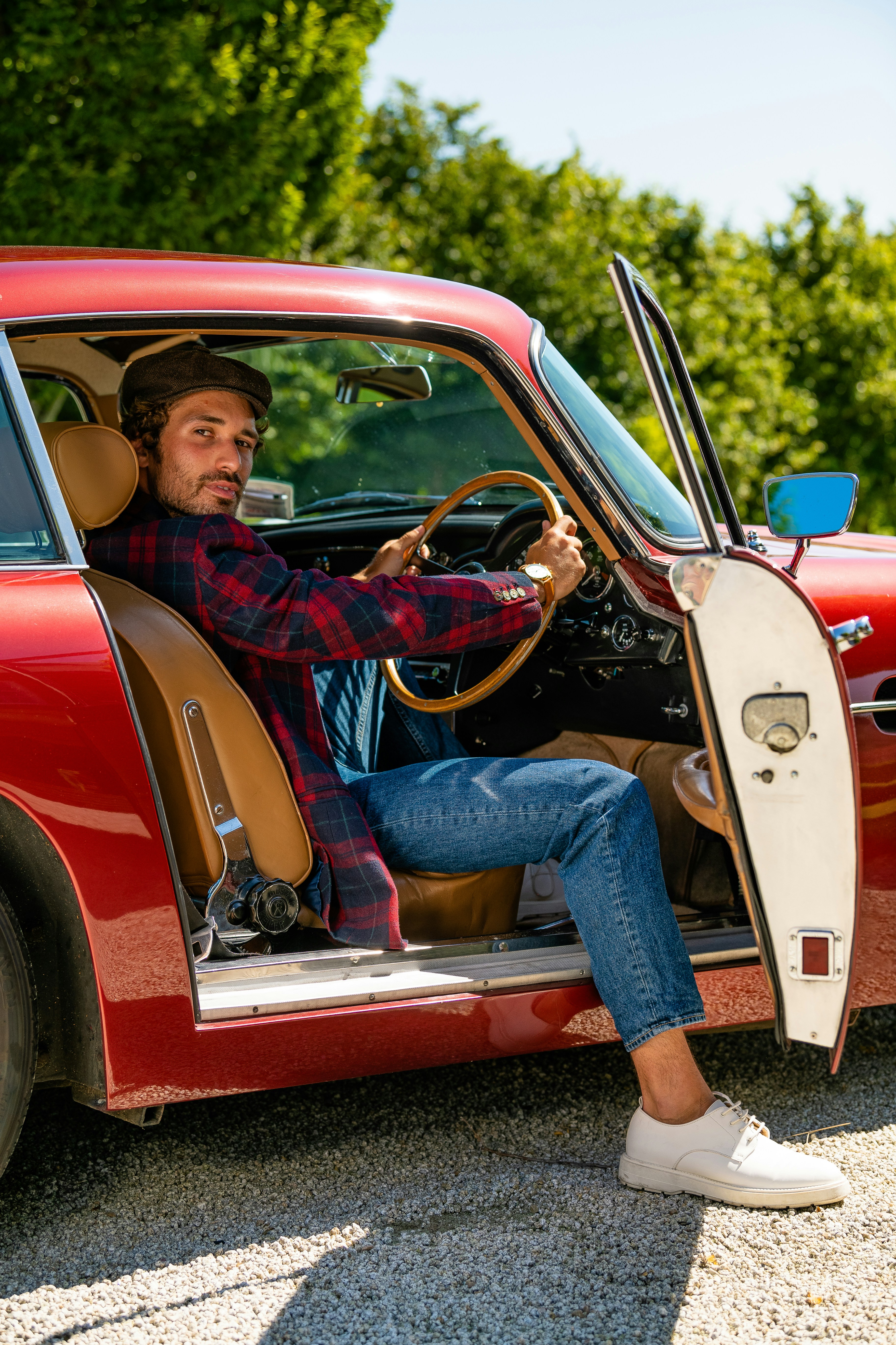 Red Convertible Quietly Ready: A Driver's Moment in Warm Sunlight