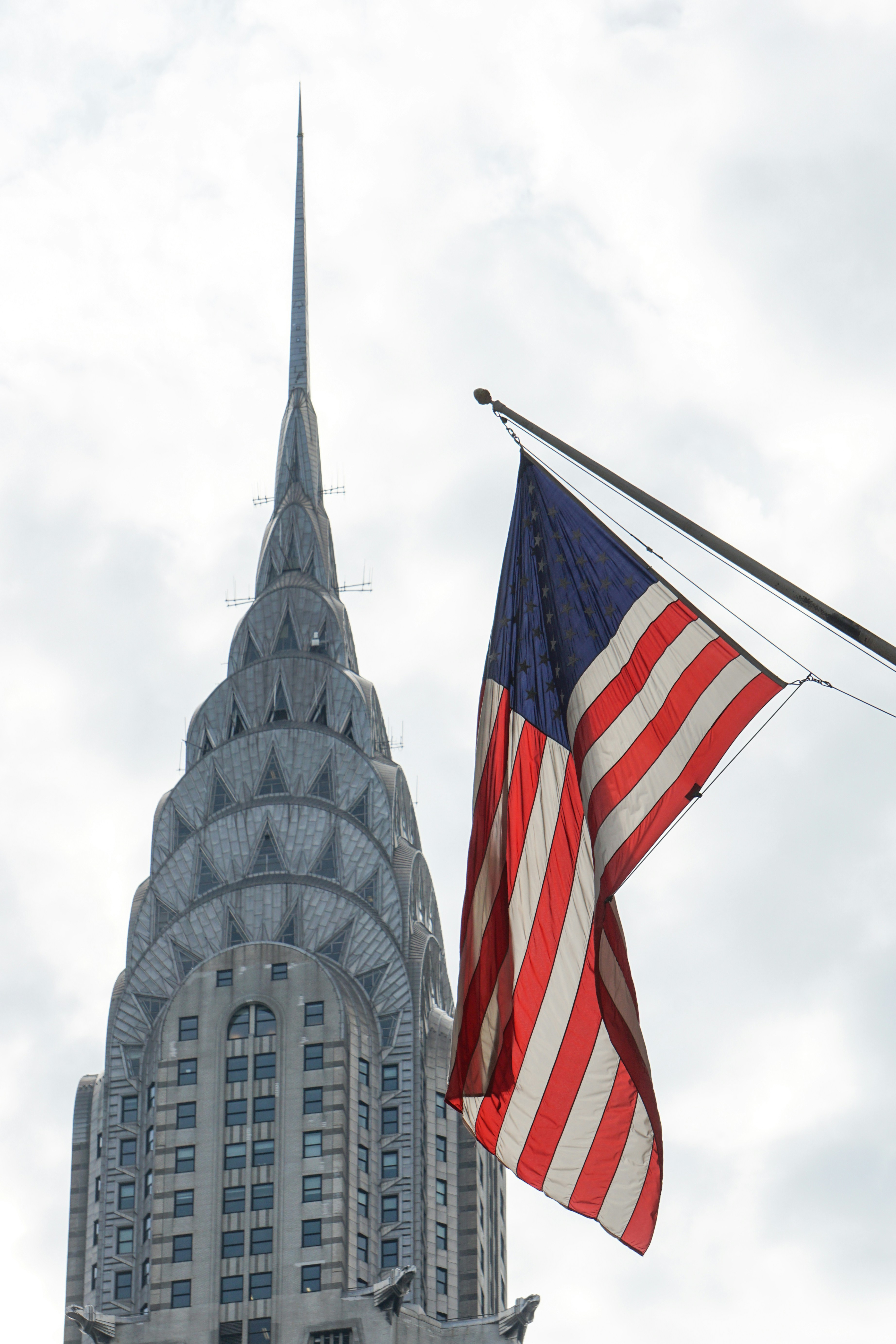 Flag-Touched Spire: NYC's Chrysler Building in the Wind