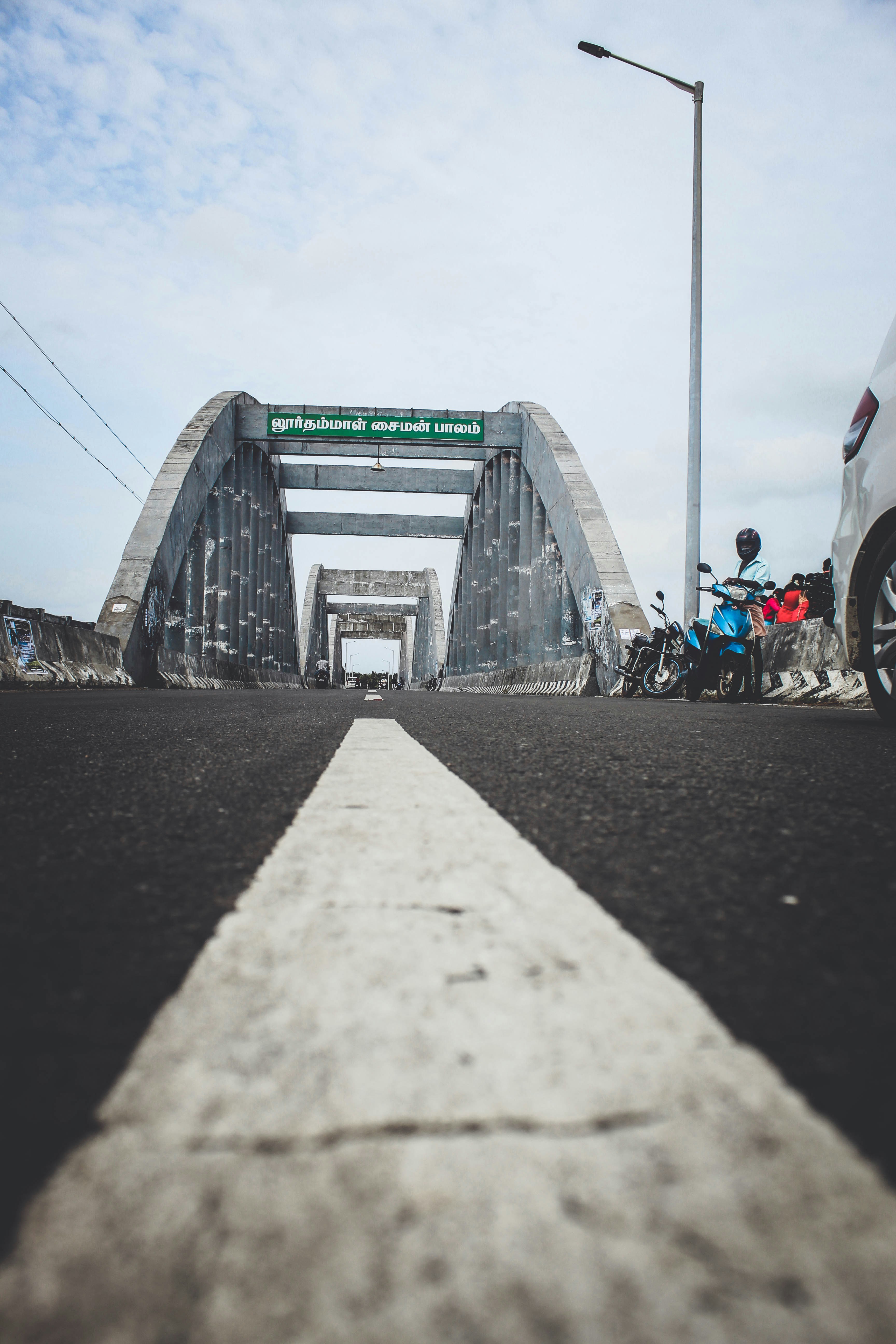 Vanishing Arches: A Low-Angle Ride Across a Steel Bridge