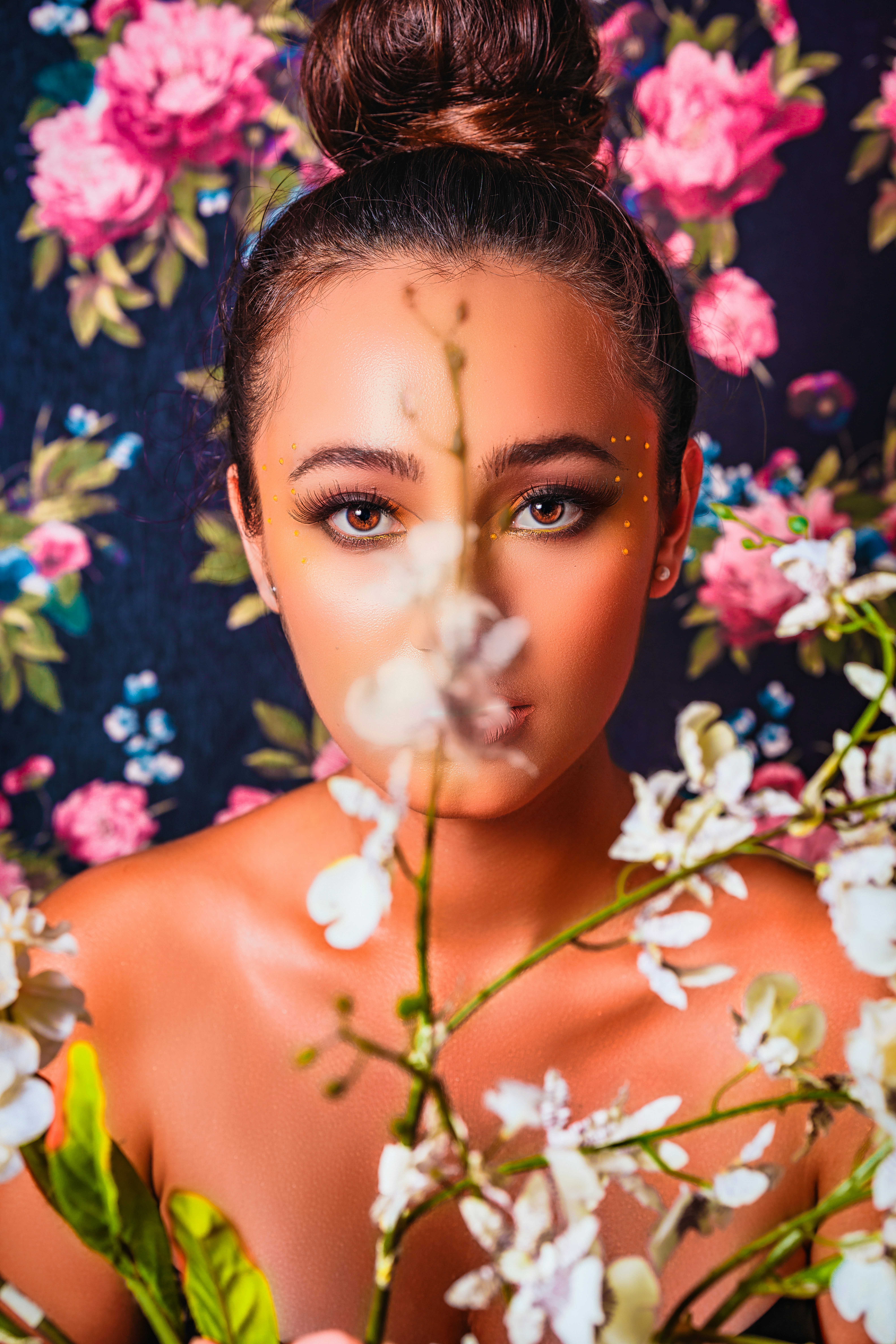 Petal Veil Portrait: A Close-Up Amid a Floral Kaleidoscope