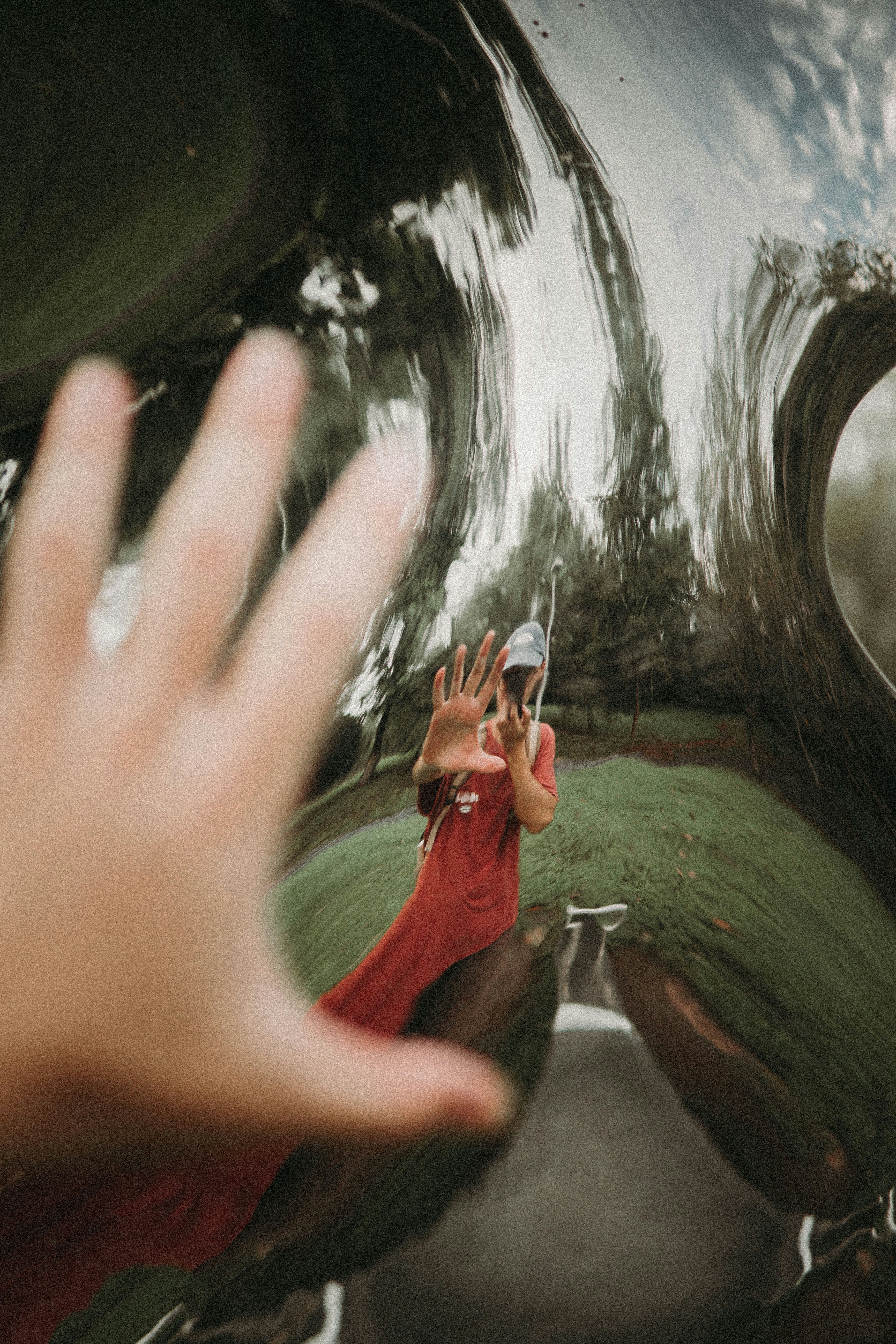 Reflected Reach: A Hand Uttered into the Infinite Spiral
