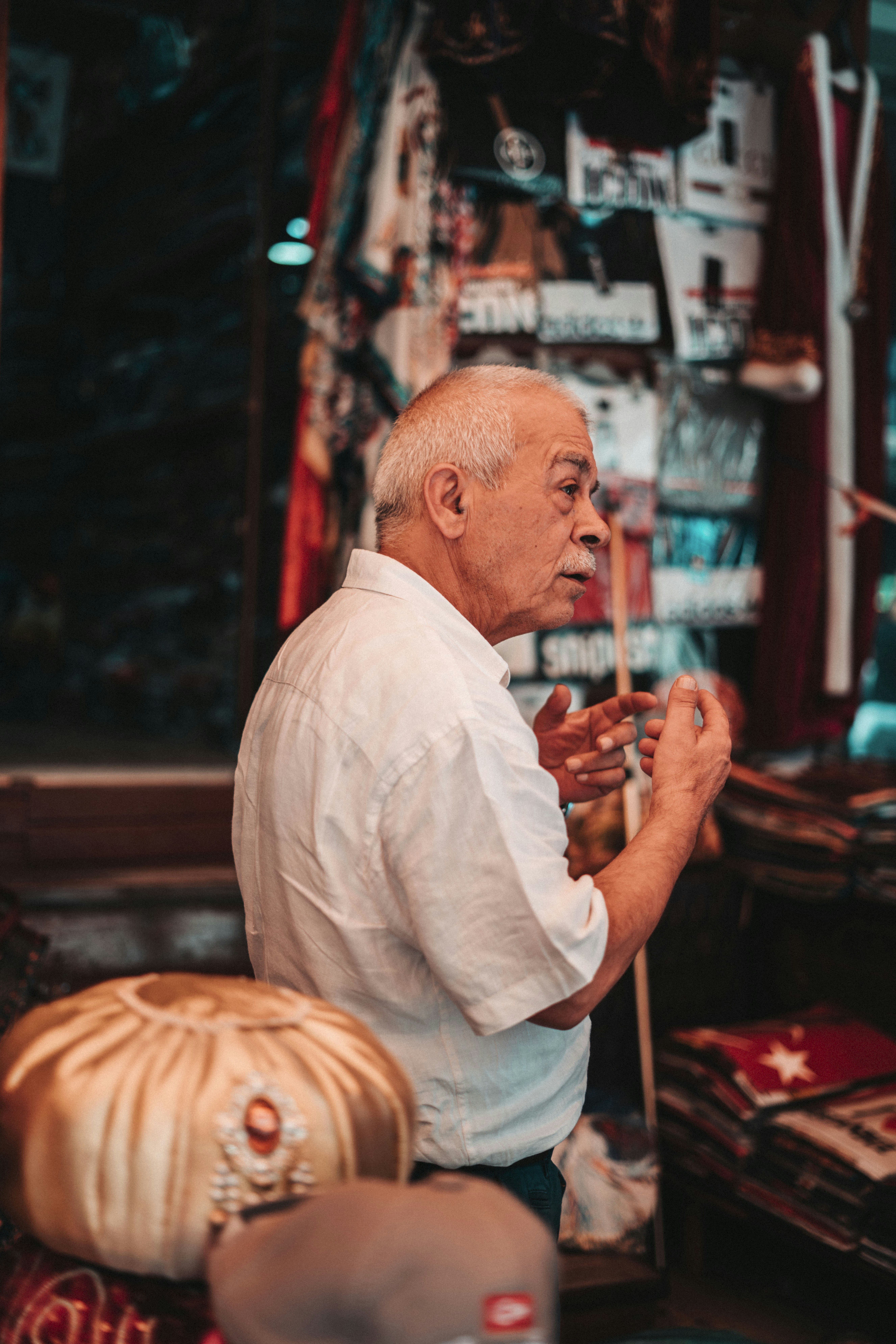 man in white dress shirt holding brown wooden stick
