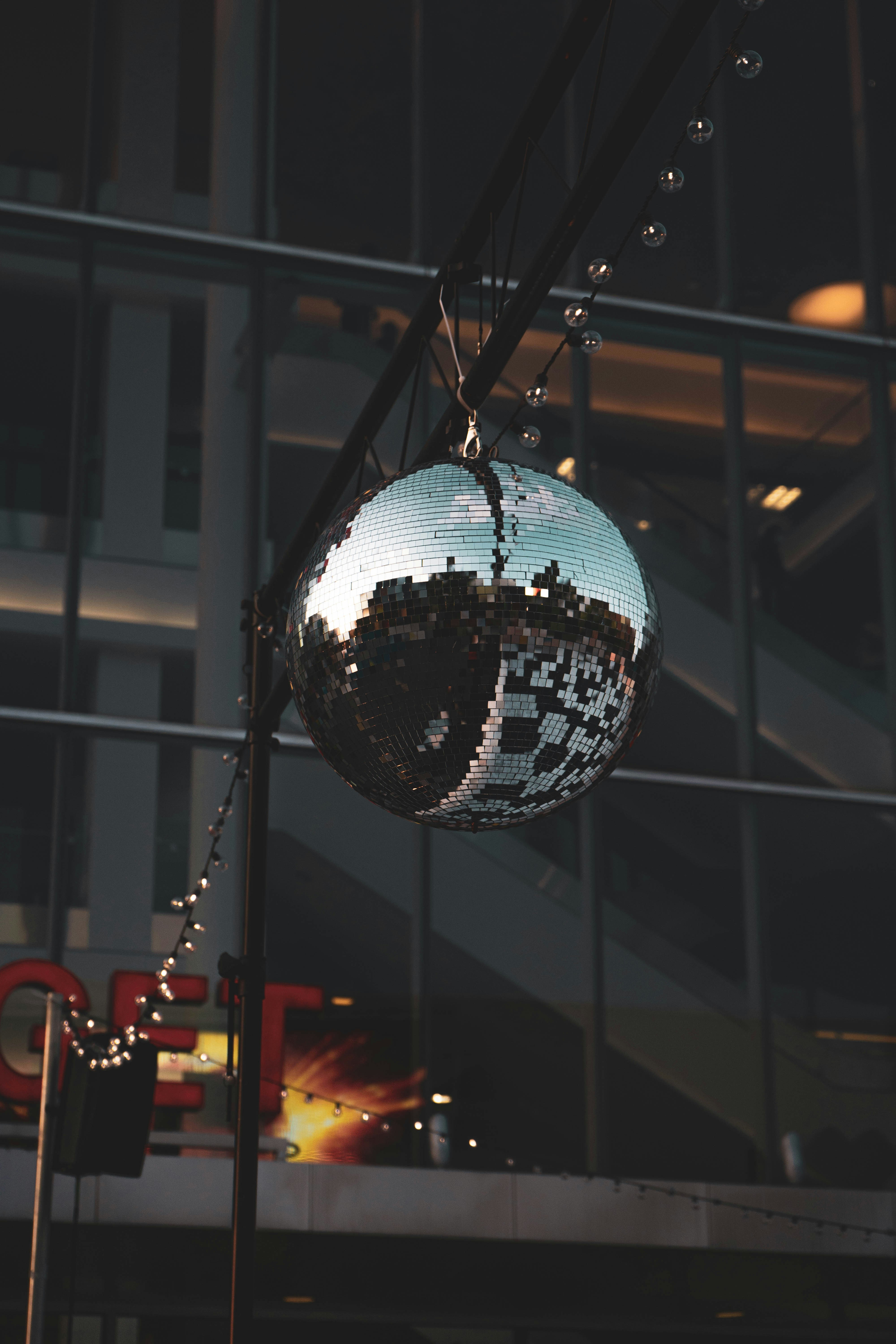 Midnight Prism: A Mirrored Ball Adorns an Atrium