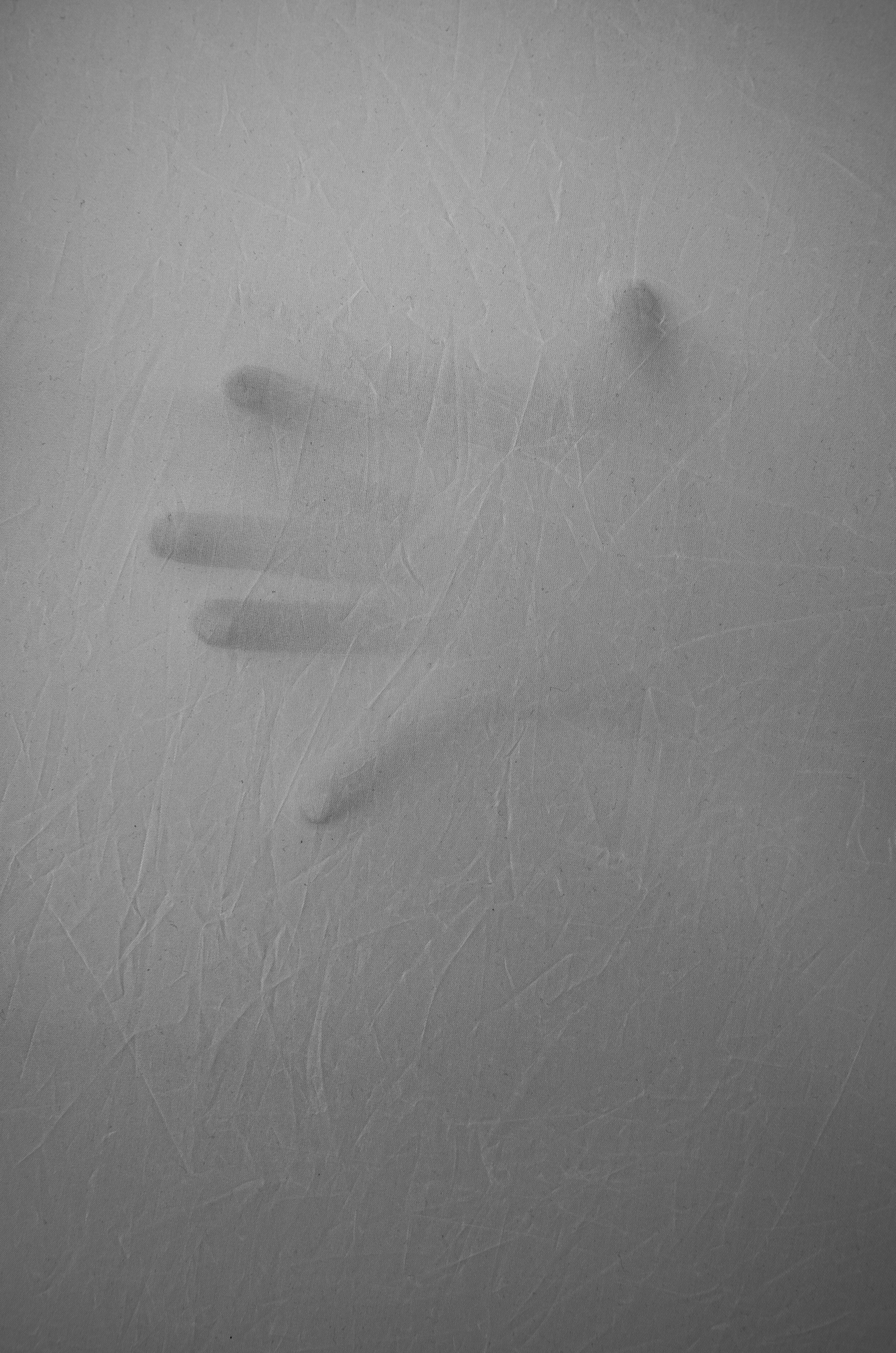 Ghost Handprint on Soft Gray Surface