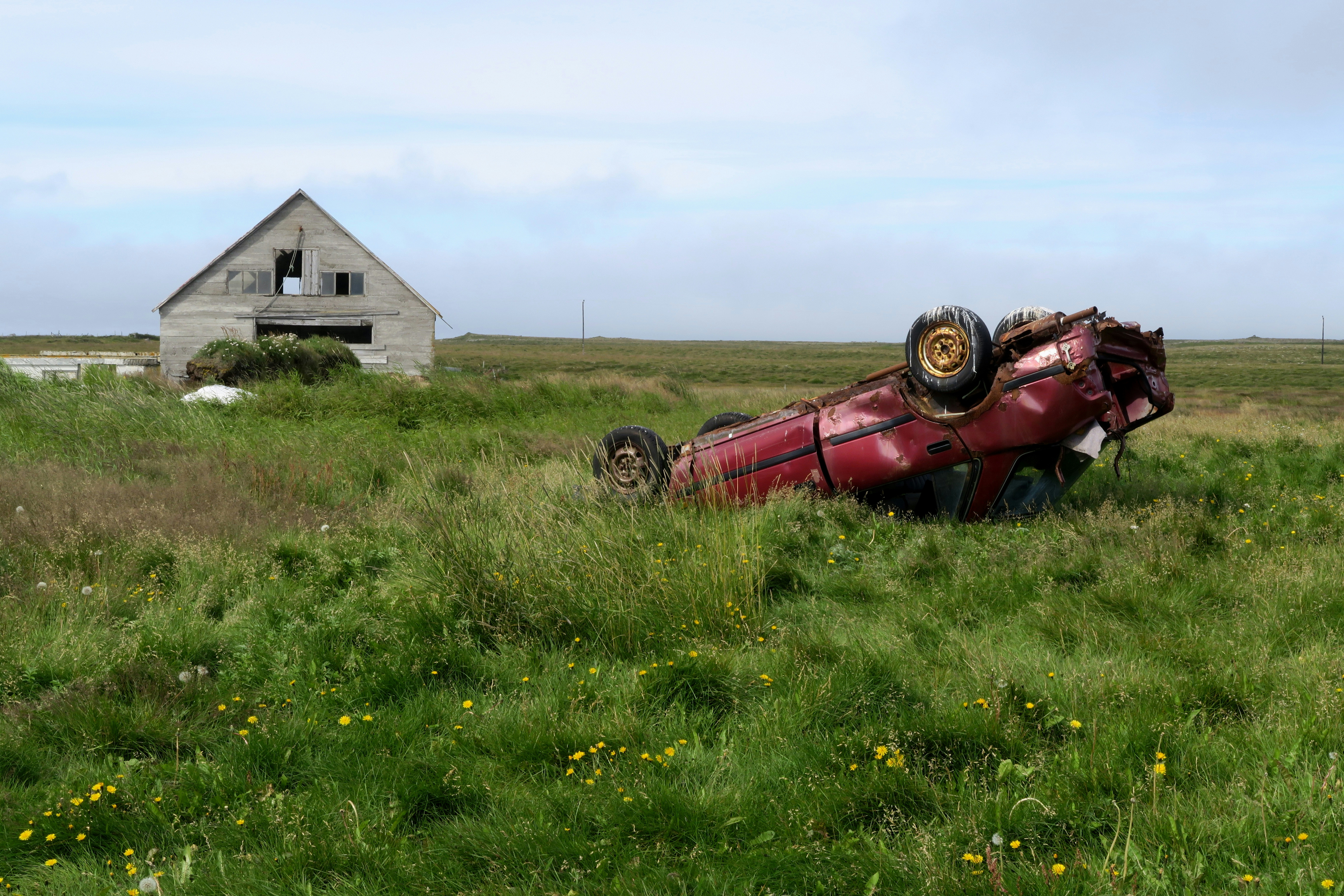 Red car on green grass field during daytime photo – Free Norðurþing ...