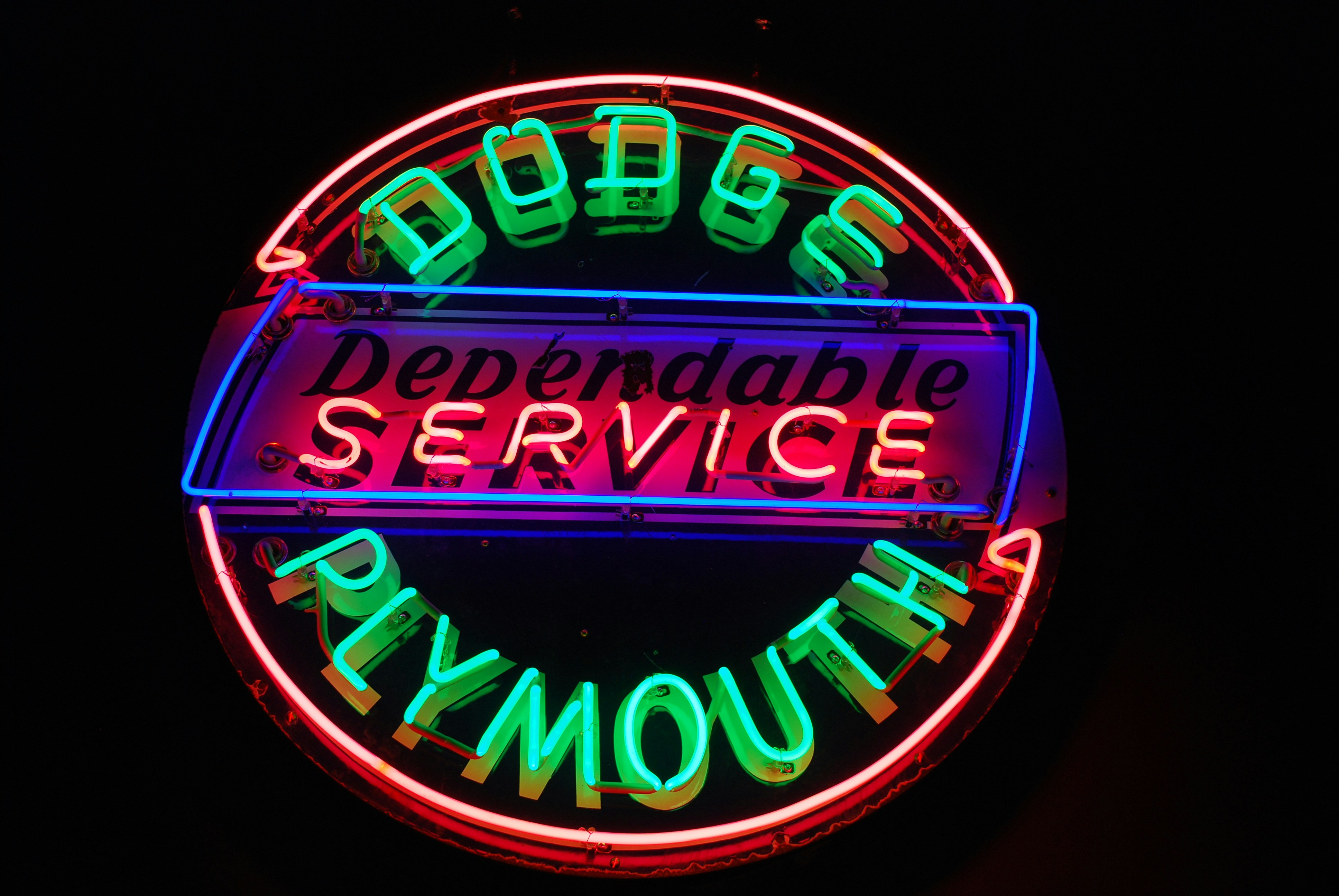 Neon Ring of Service: Plymouth’s Night Sign