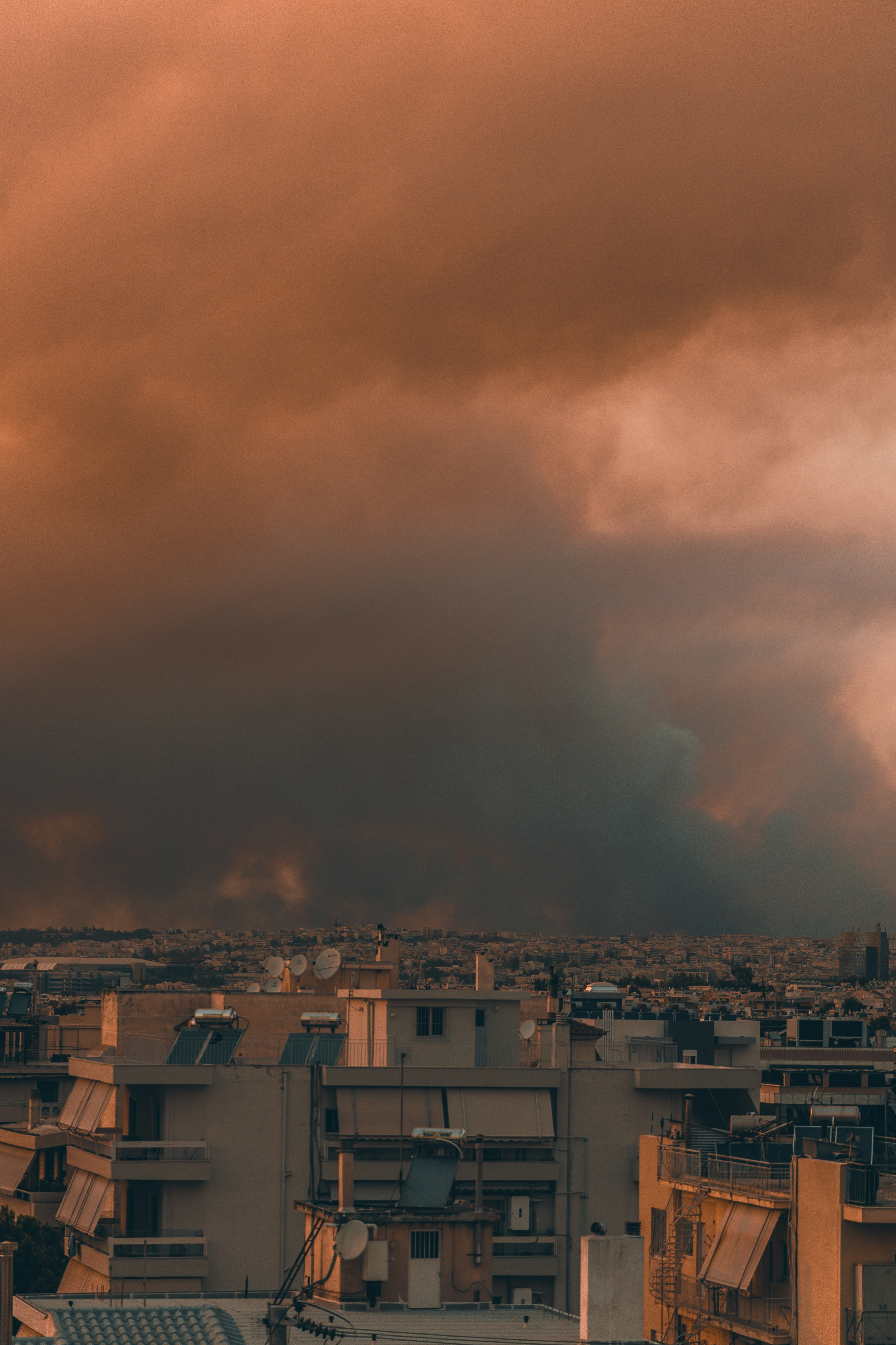 White and brown concrete buildings under white clouds during daytime ...