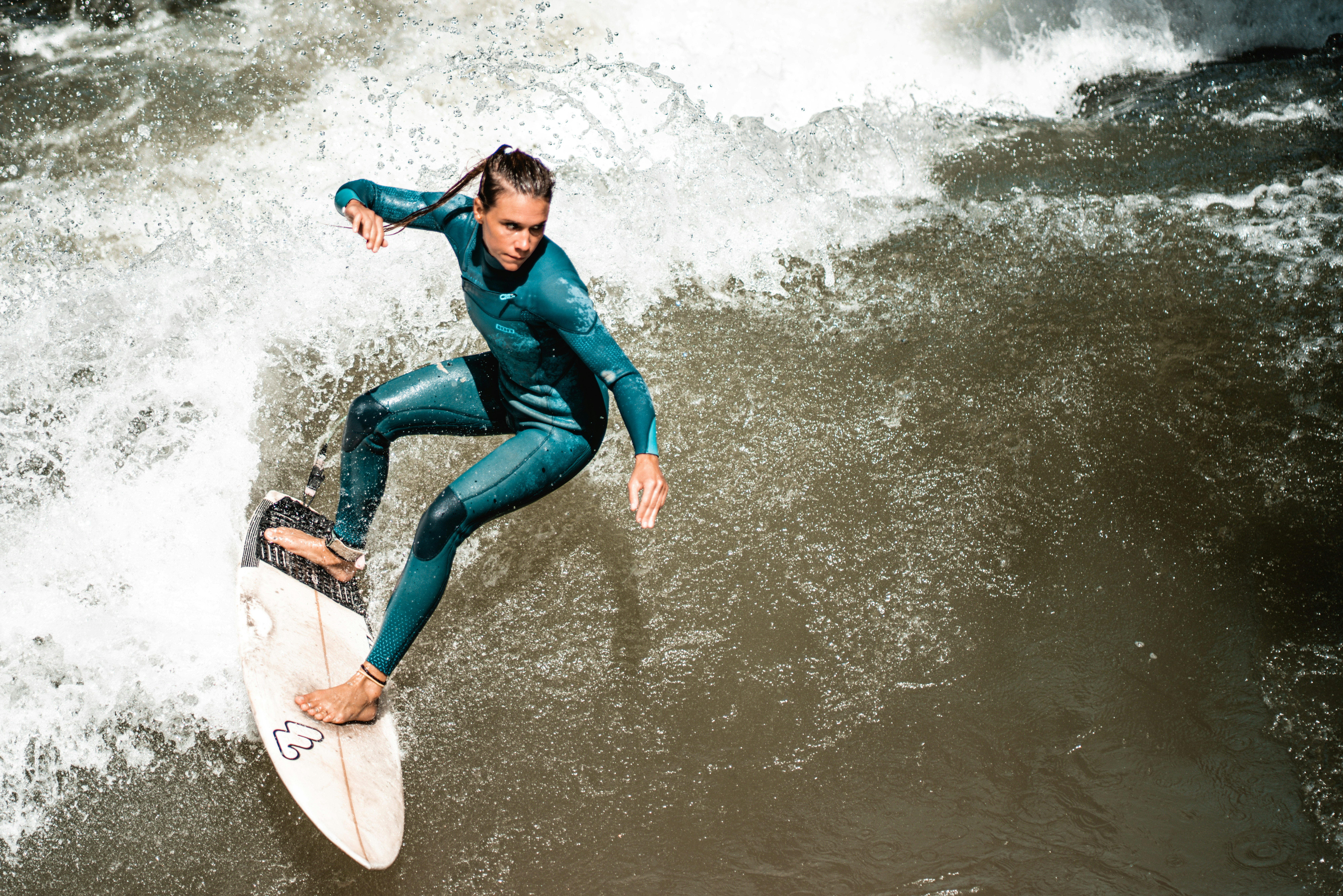 Airborne Curve: Surfer Carves a Lip on a Tidal Canvas