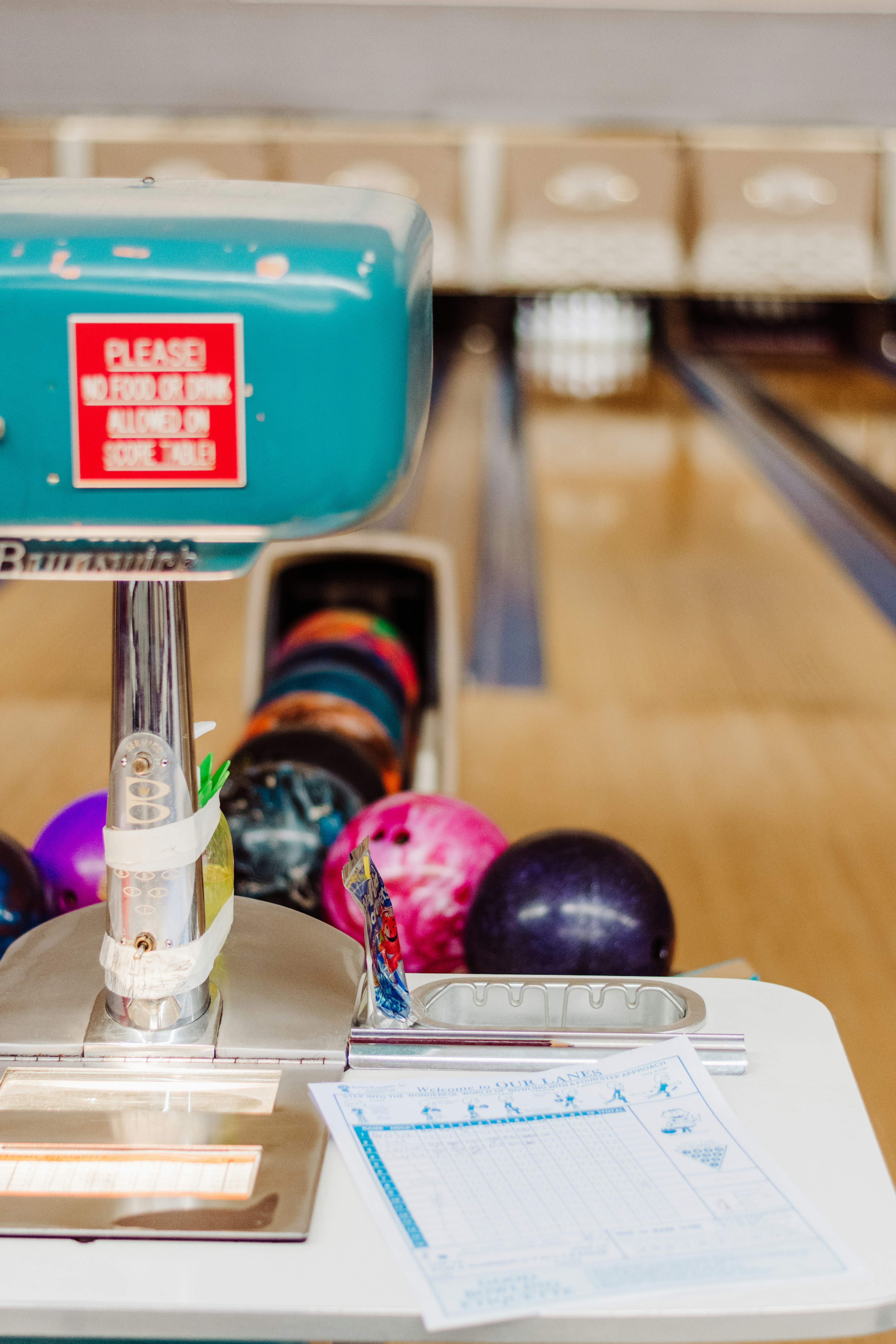 Colorful Bowling Alley Ball Rack and Pinsetter