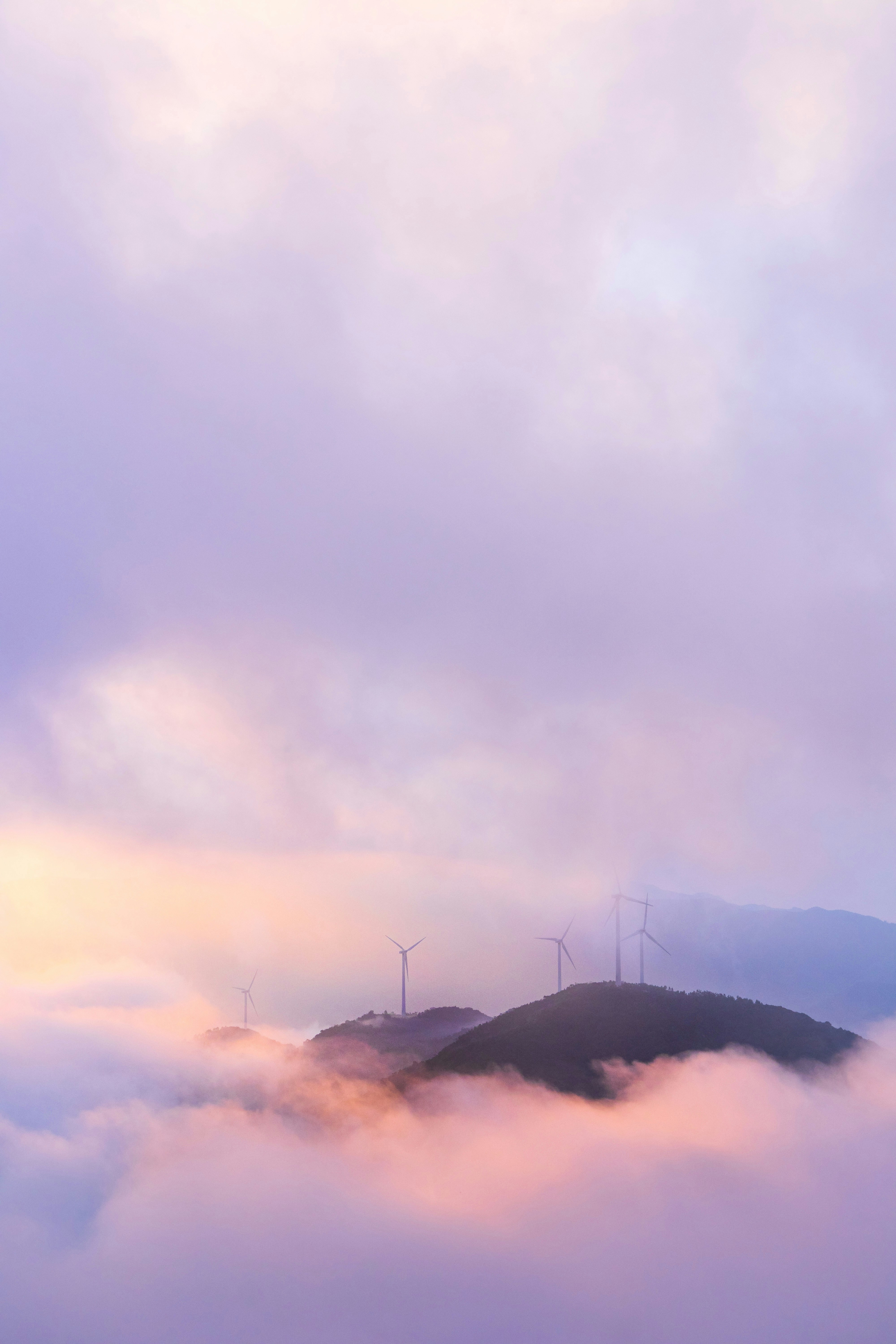 Dawn over a Sea of Clouds: Wind Turbines on a Mist-Kissed Ridge