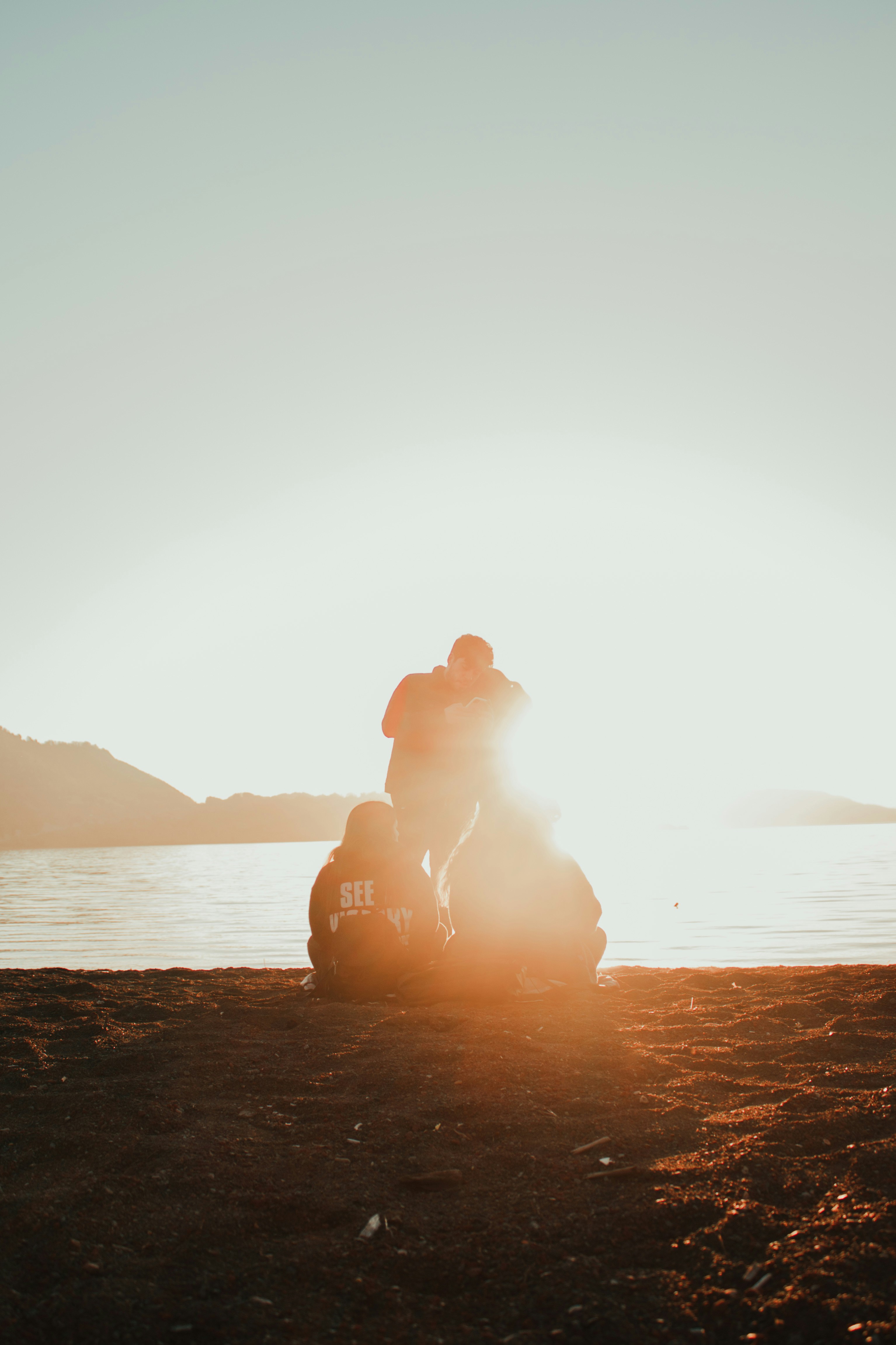 Last Light on the Shore: Silhouettes Framing a Sunset Moment