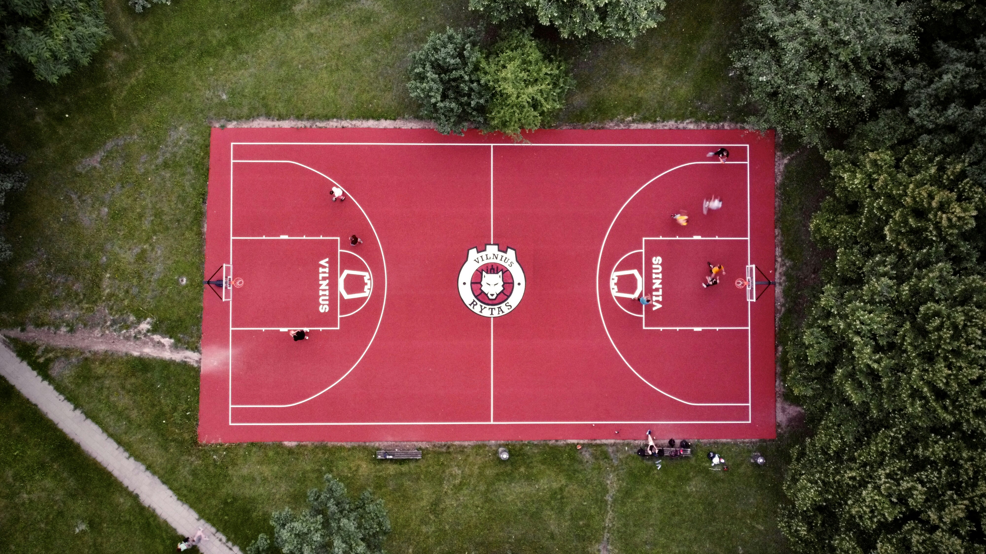 Red and white basketball court photo – Free Vilnius Image on Unsplash