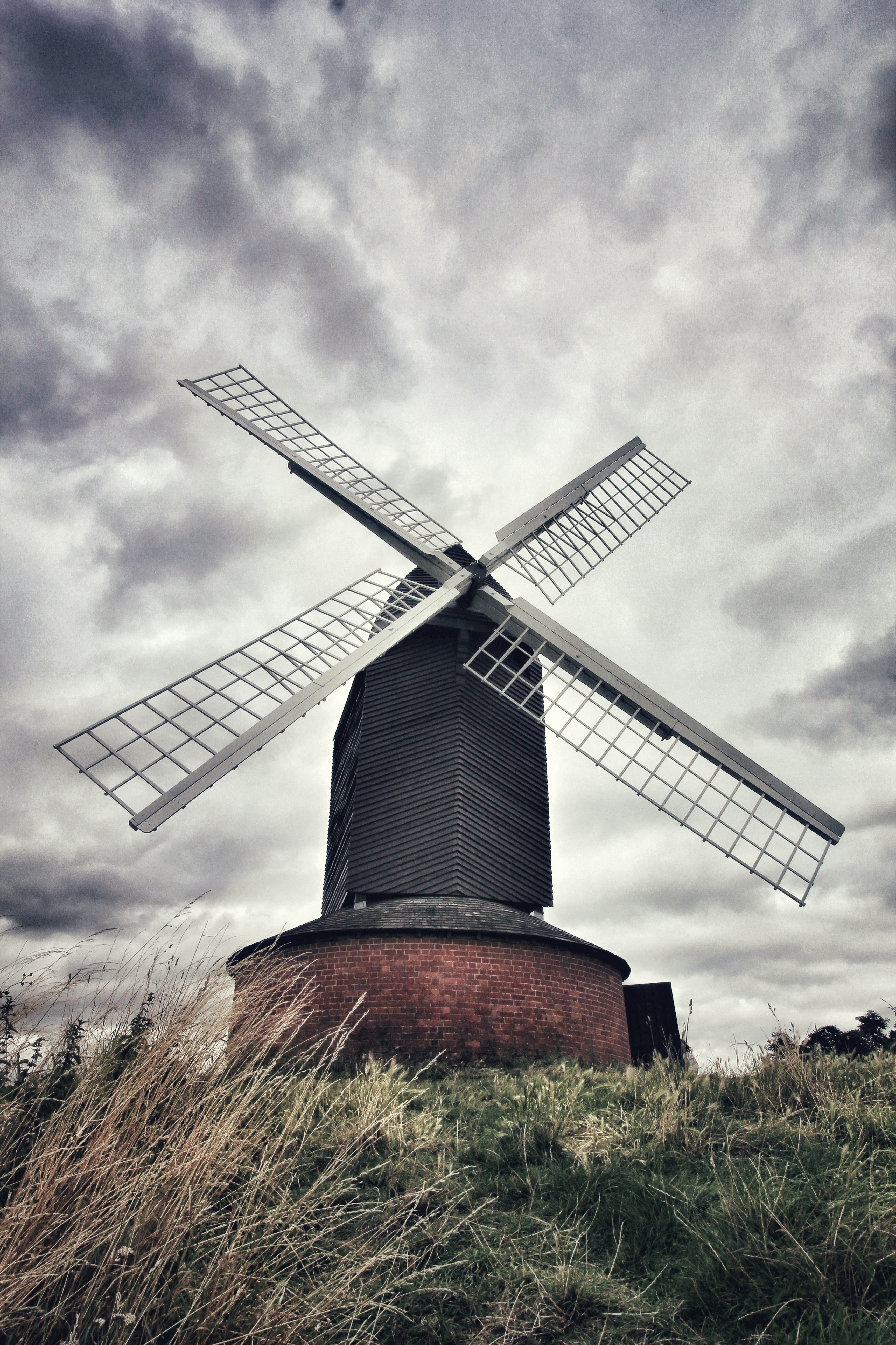 Brown and gray windmill under cloudy sky during daytime photo – Free ...
