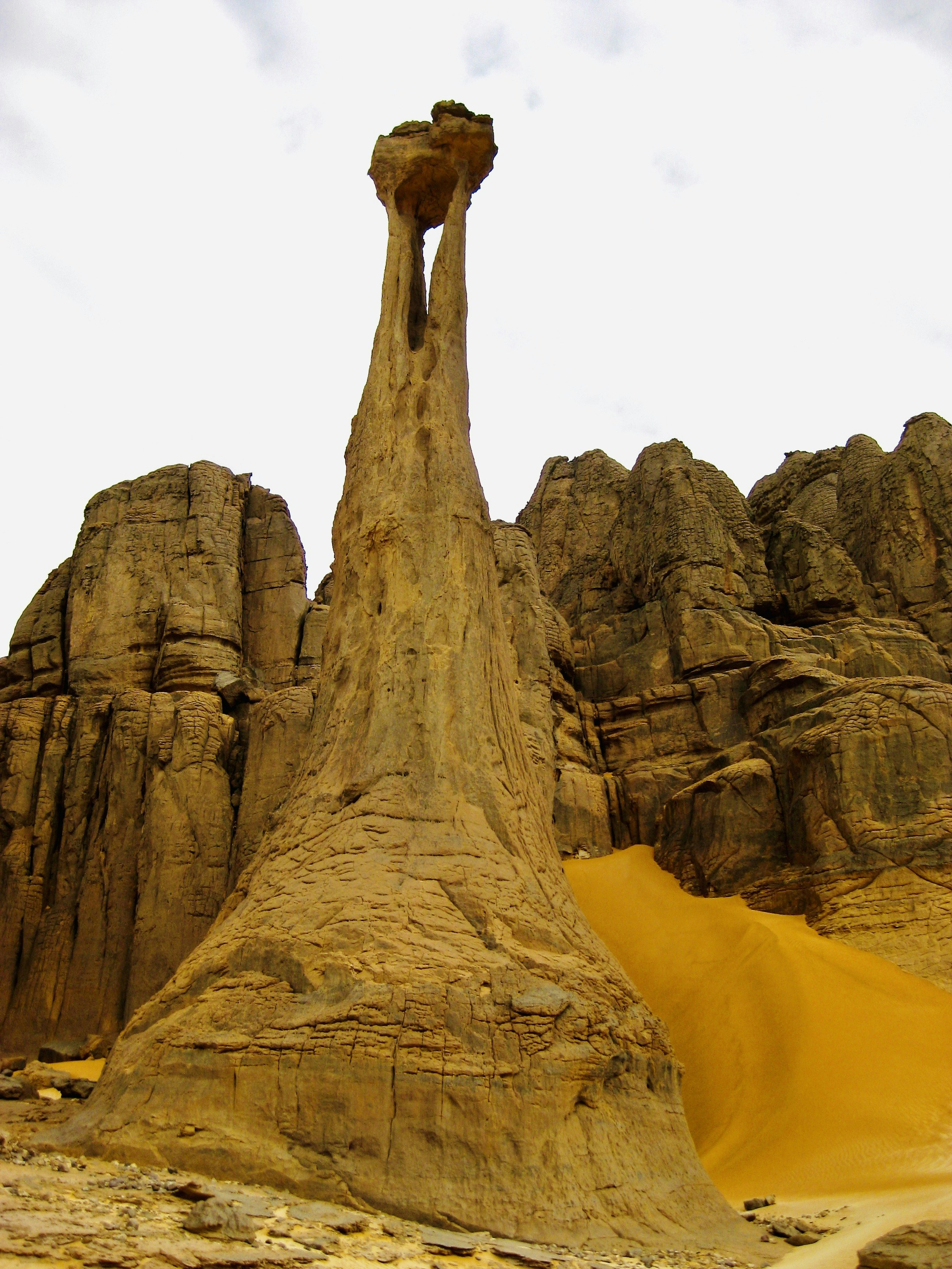 Desert Column with Natural Arch Crowned in Sand