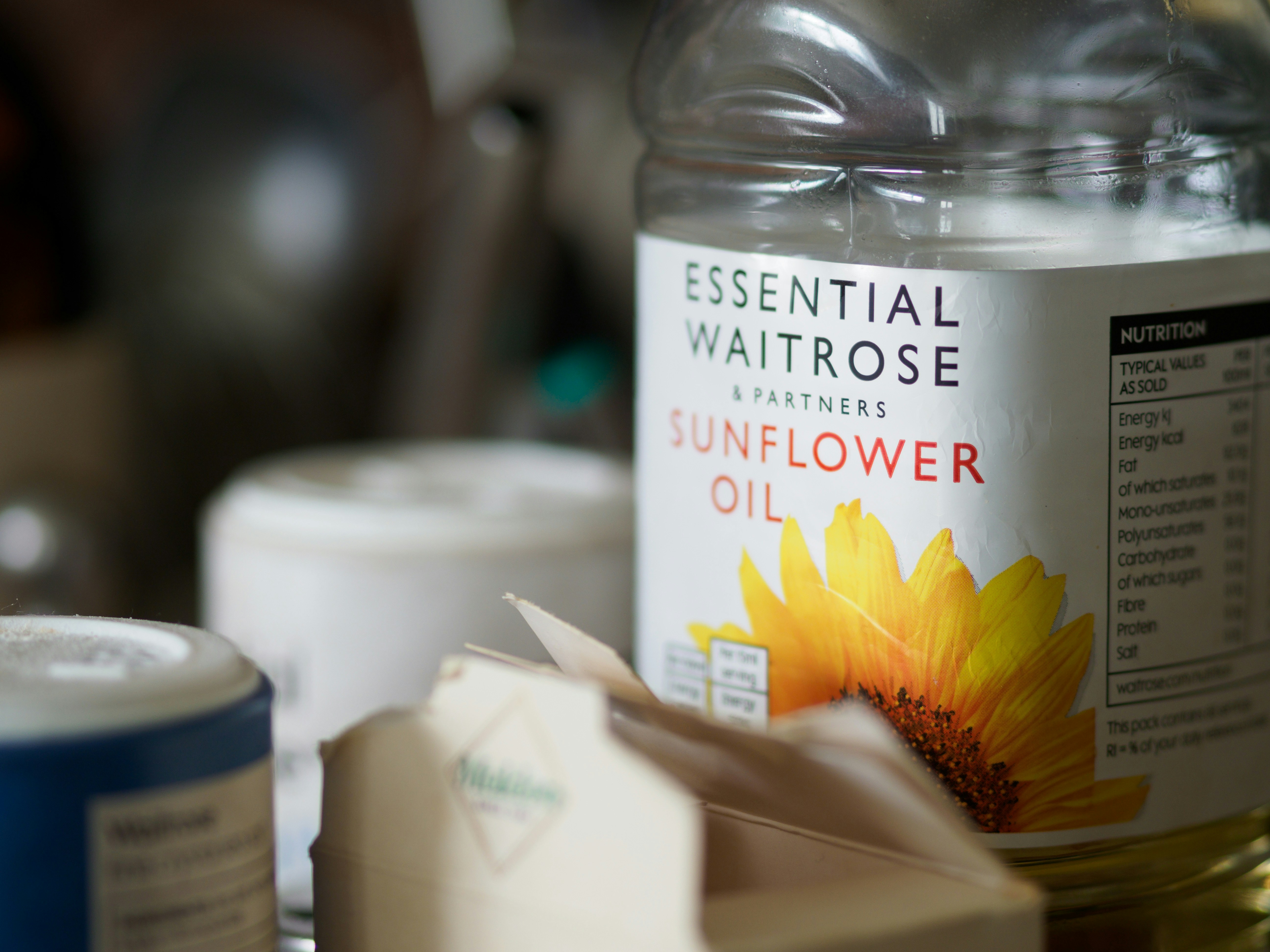 Sunflower Oil Bottle: Bold Label Amid Soft Kitchen Blur