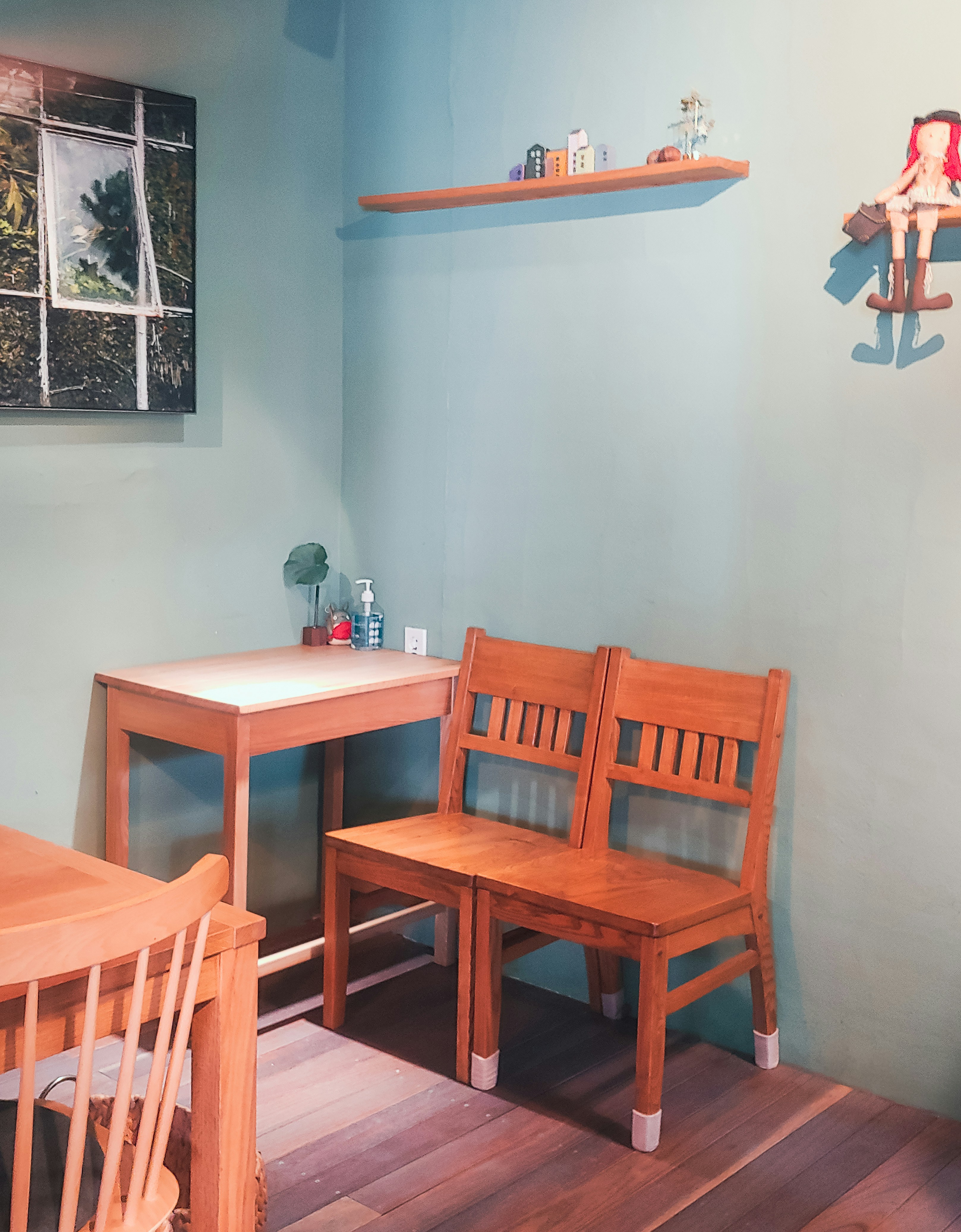 Pastel bistro corner with wooden seating