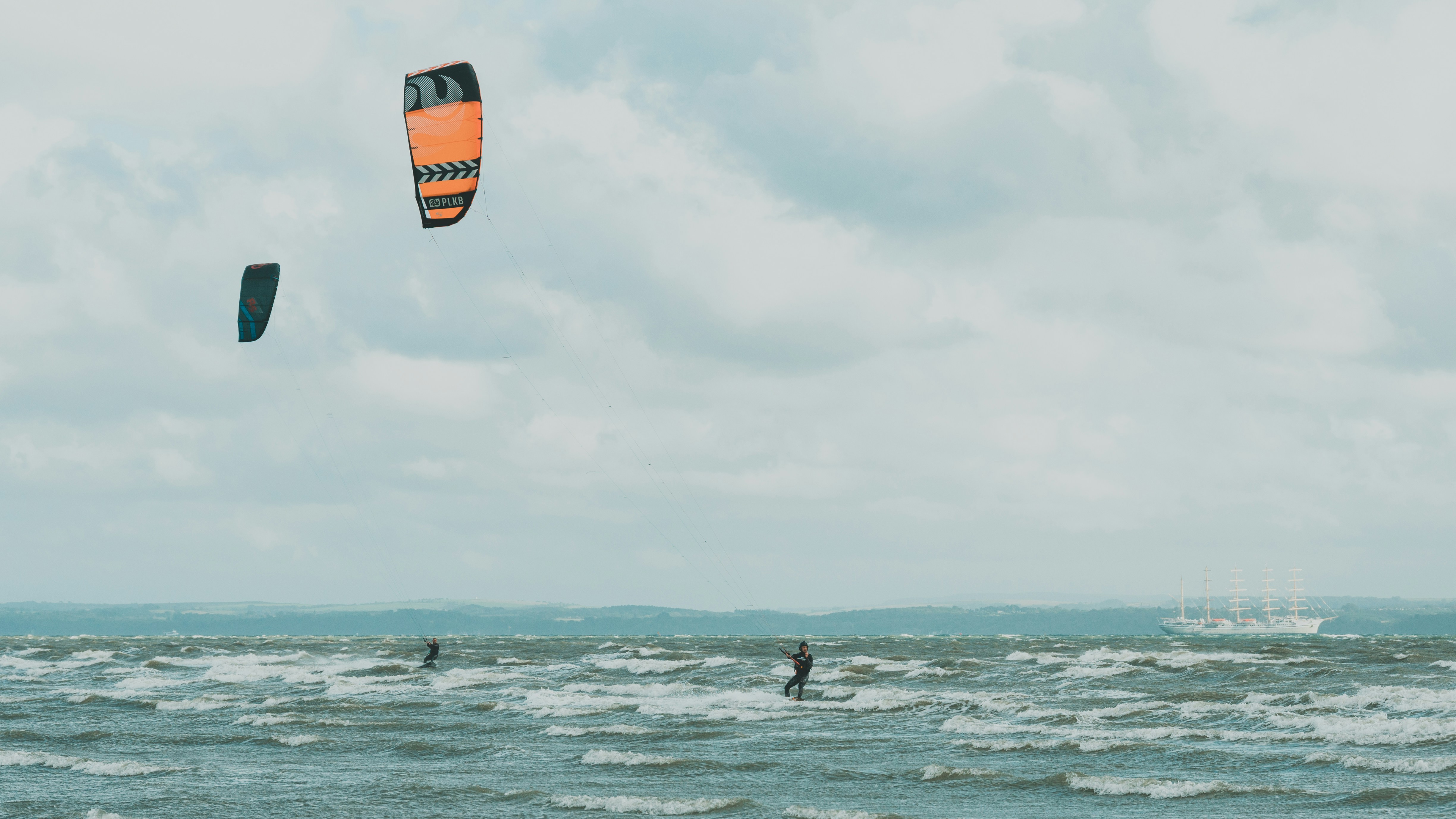Person surfing on sea under cloudy sky during daytime photo – Free Meon ...