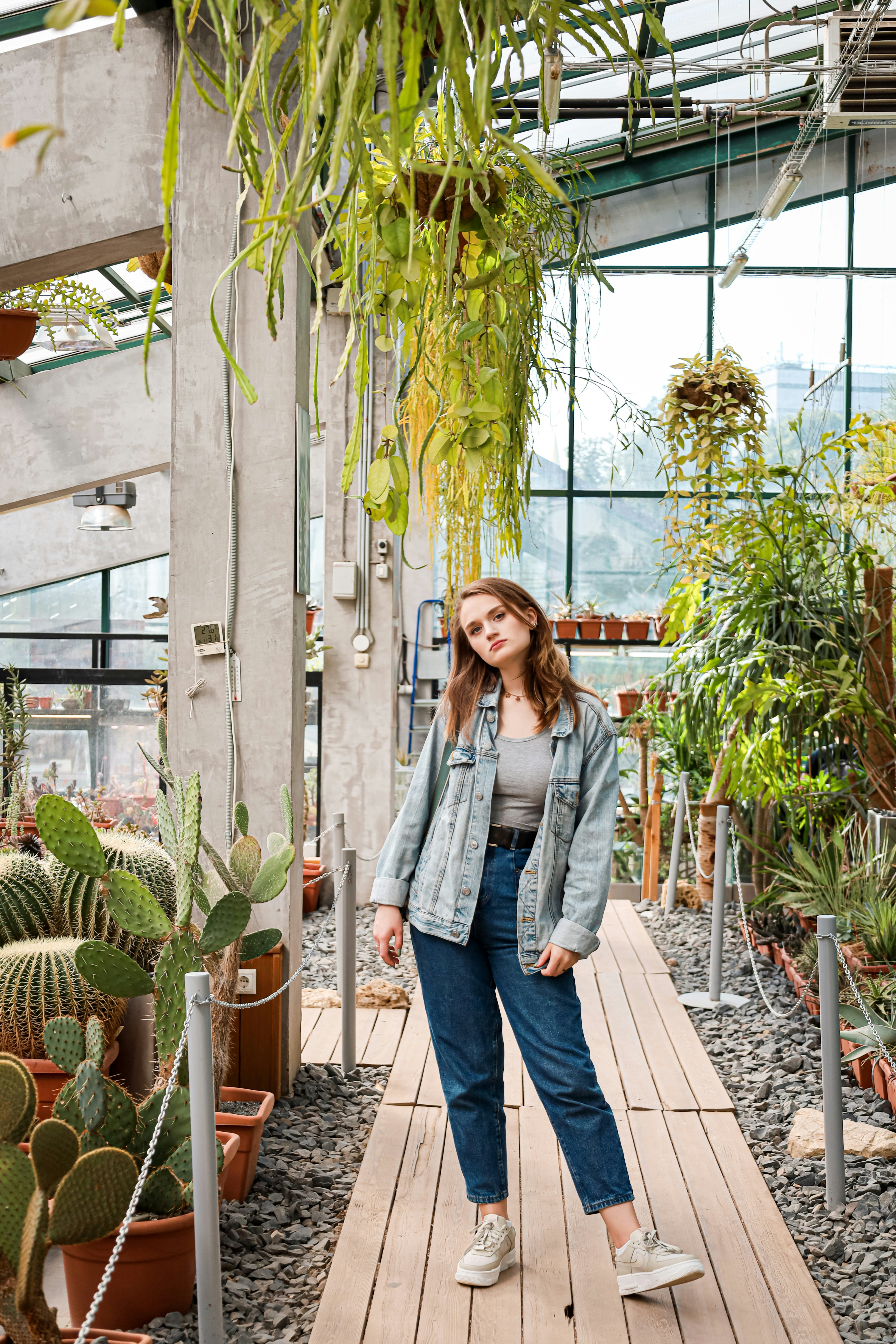 Denim Jacket Wanderer in a Lush Conservatory