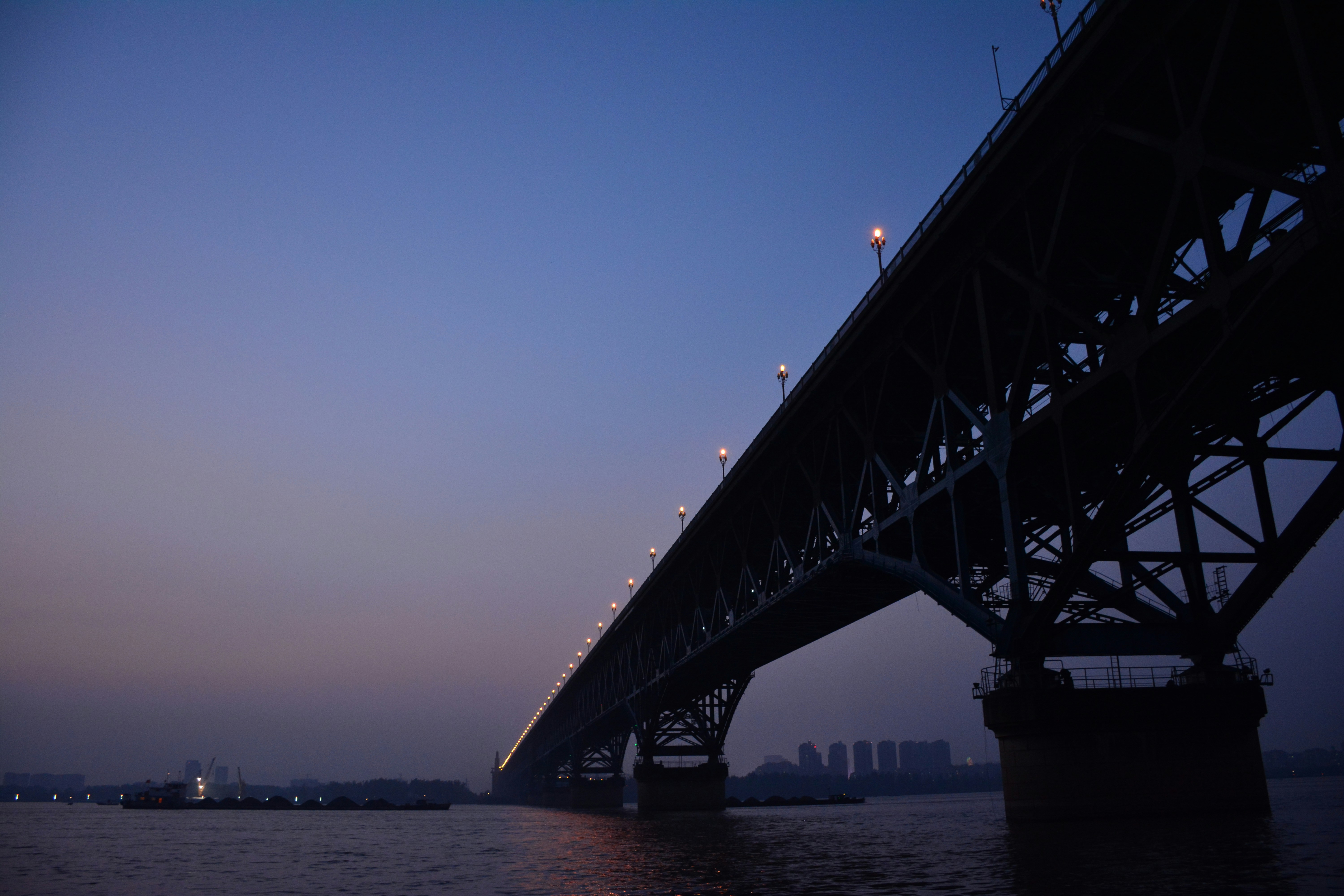 Gray concrete bridge over body of water during daytime photo – Free ...