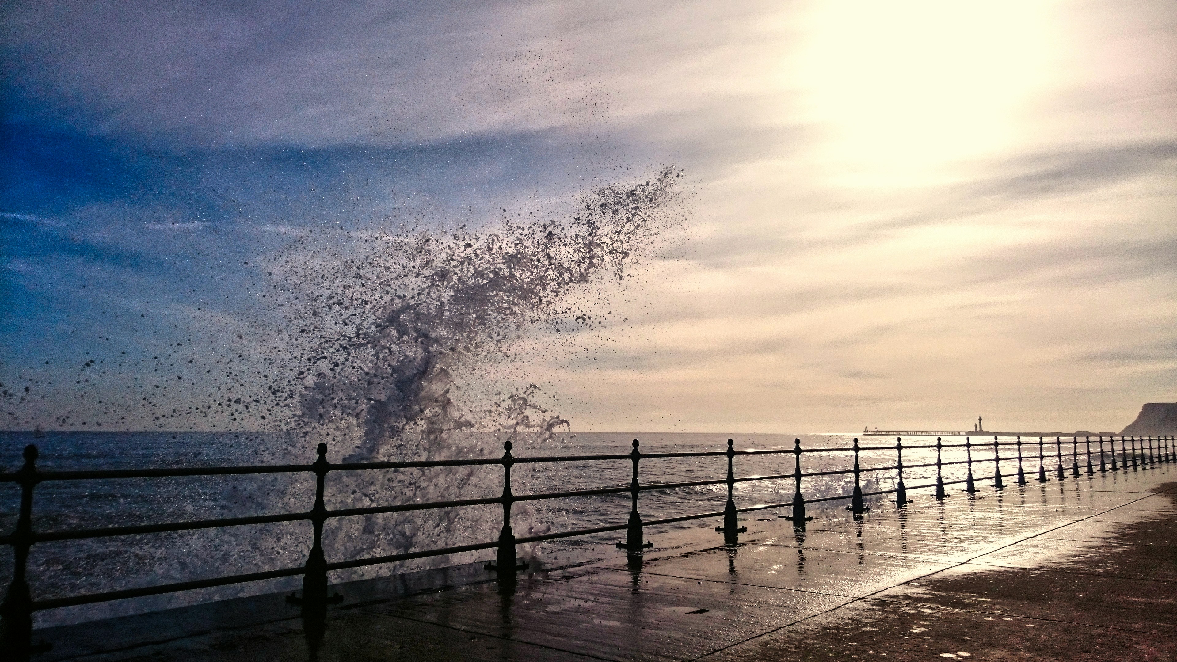 Sea waves crashing on wooden dock during sunset photo – Free Whitby ...