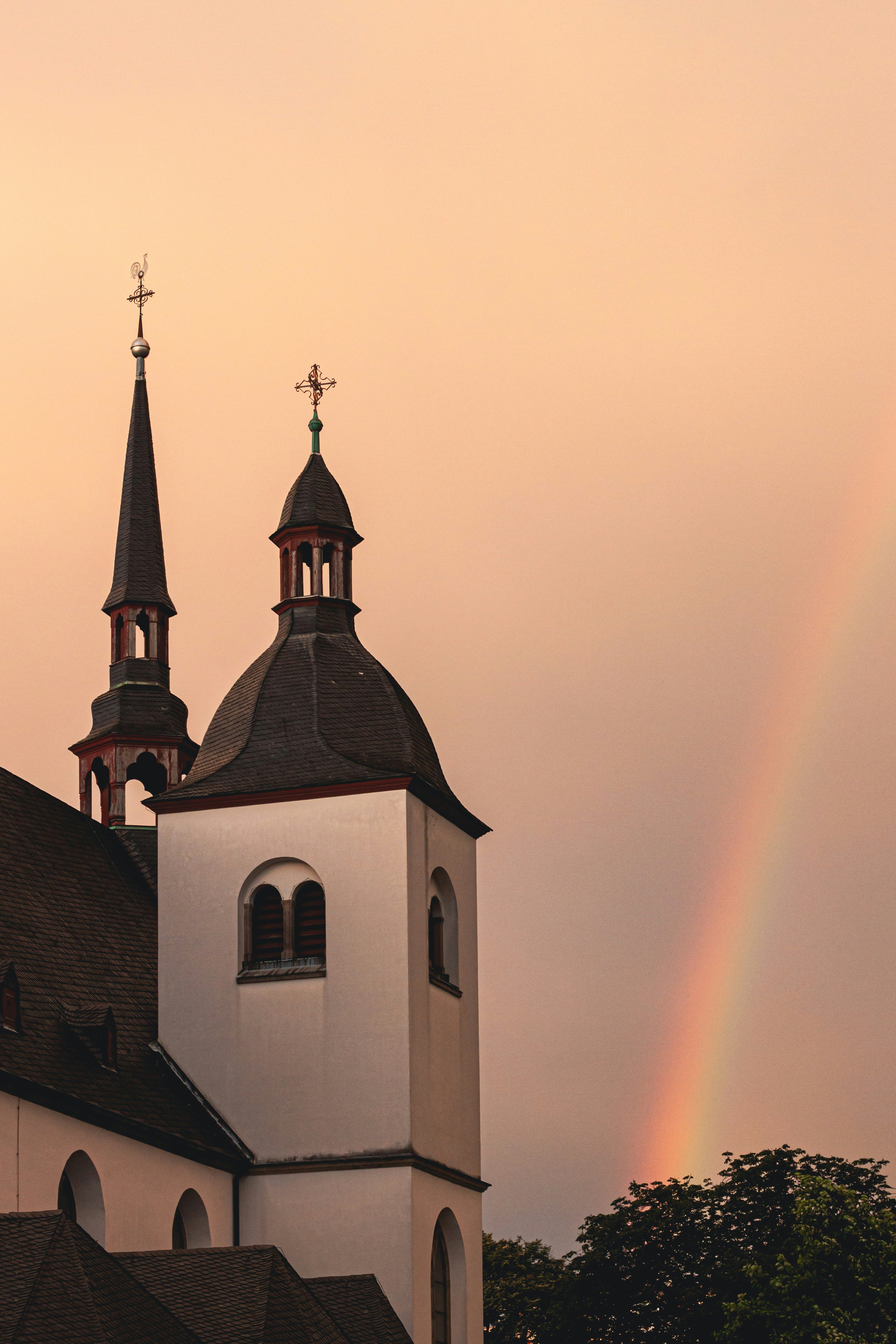 Twin Spires at Dusk, Framed by a Gentle Rainbow