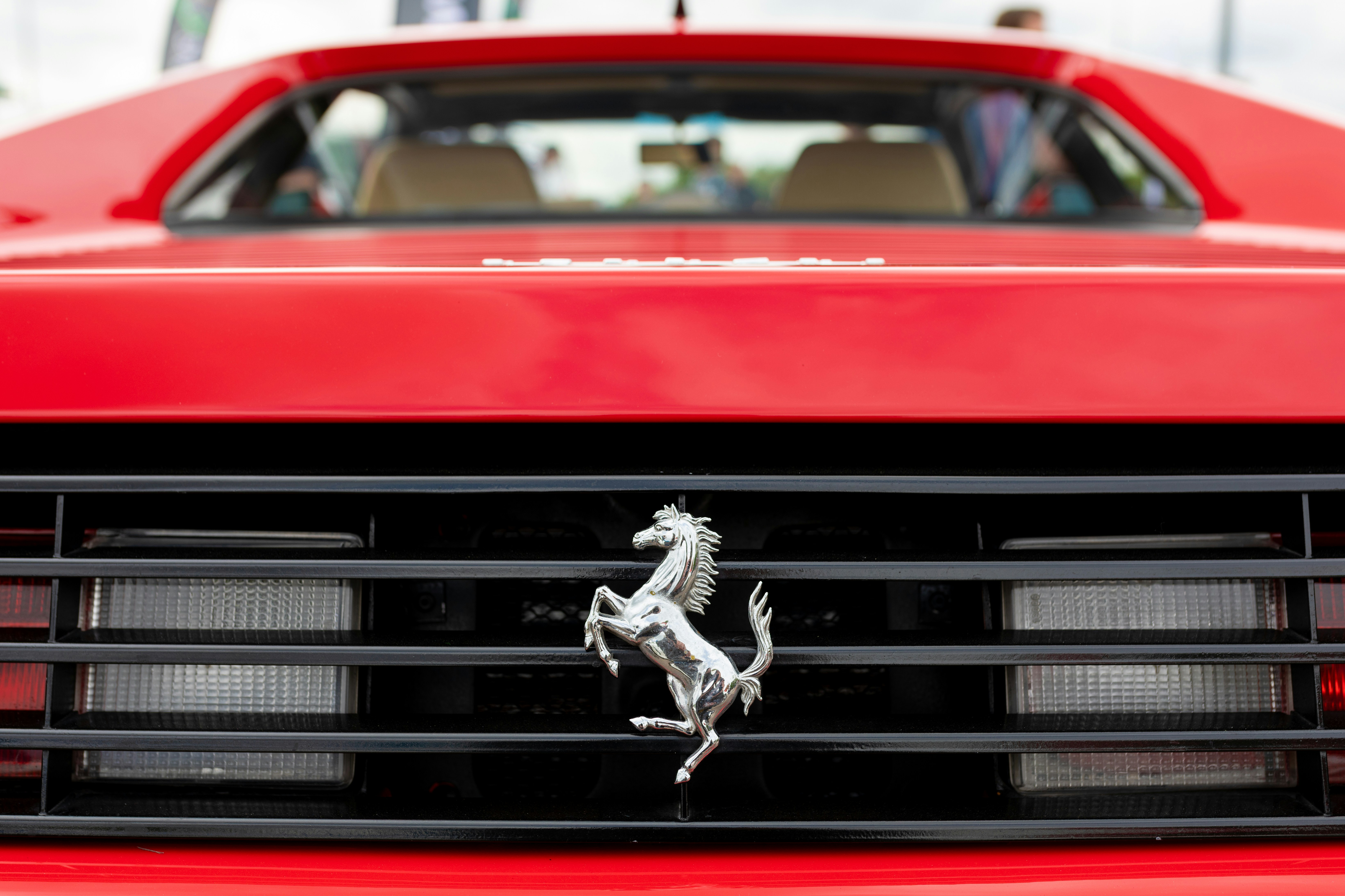 Crimson Grille, Silver Stallion: Ferrari Emblem in Focus