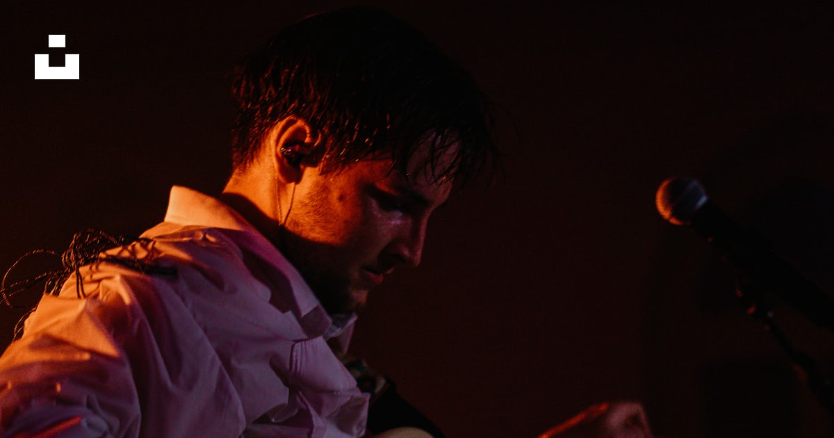 Man In Blue Dress Shirt Playing Electric Guitar Photo Free Human