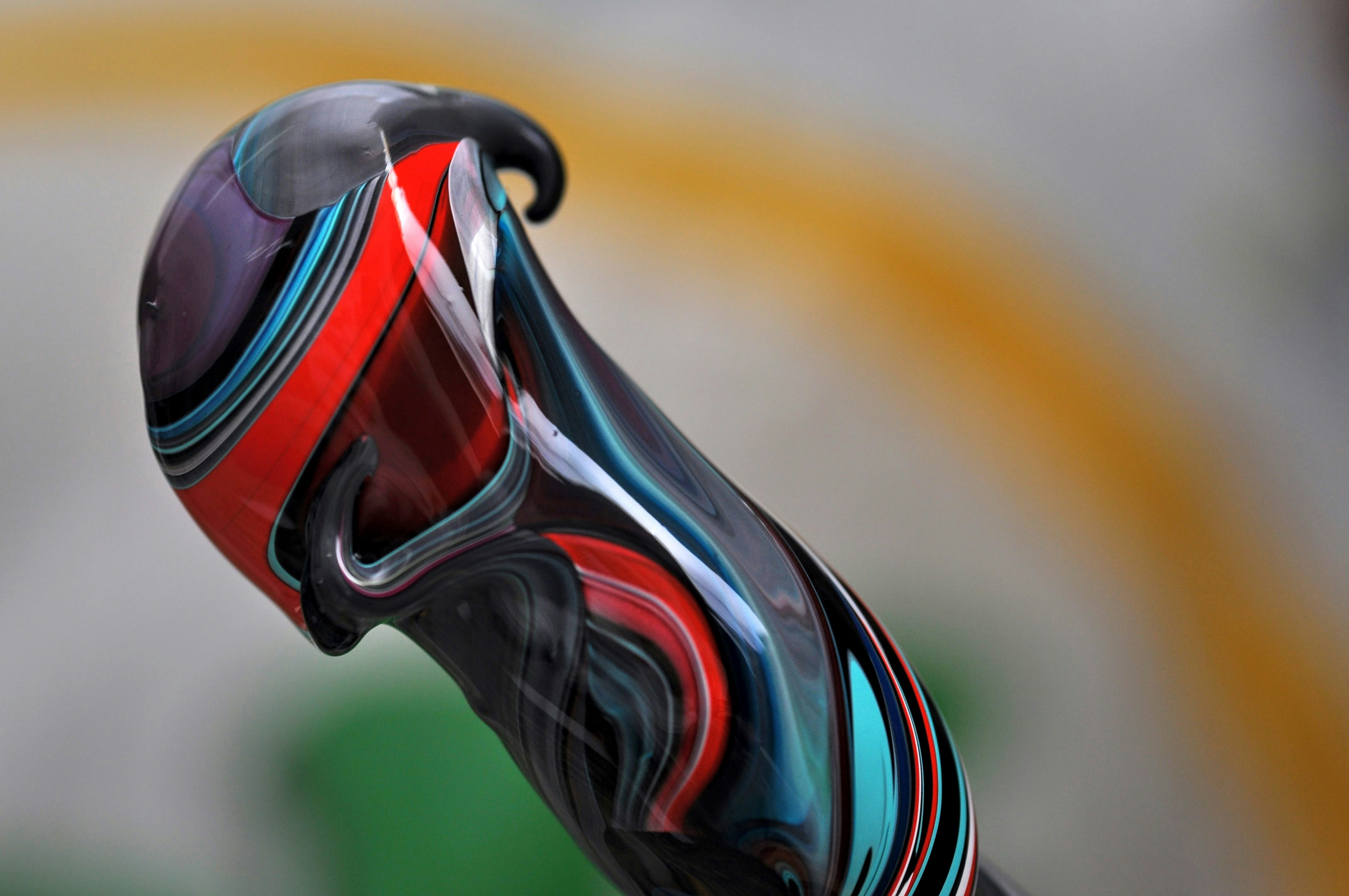 Chromatic Whorl: Hand-Blown Glass Sculpture in Soft Focus