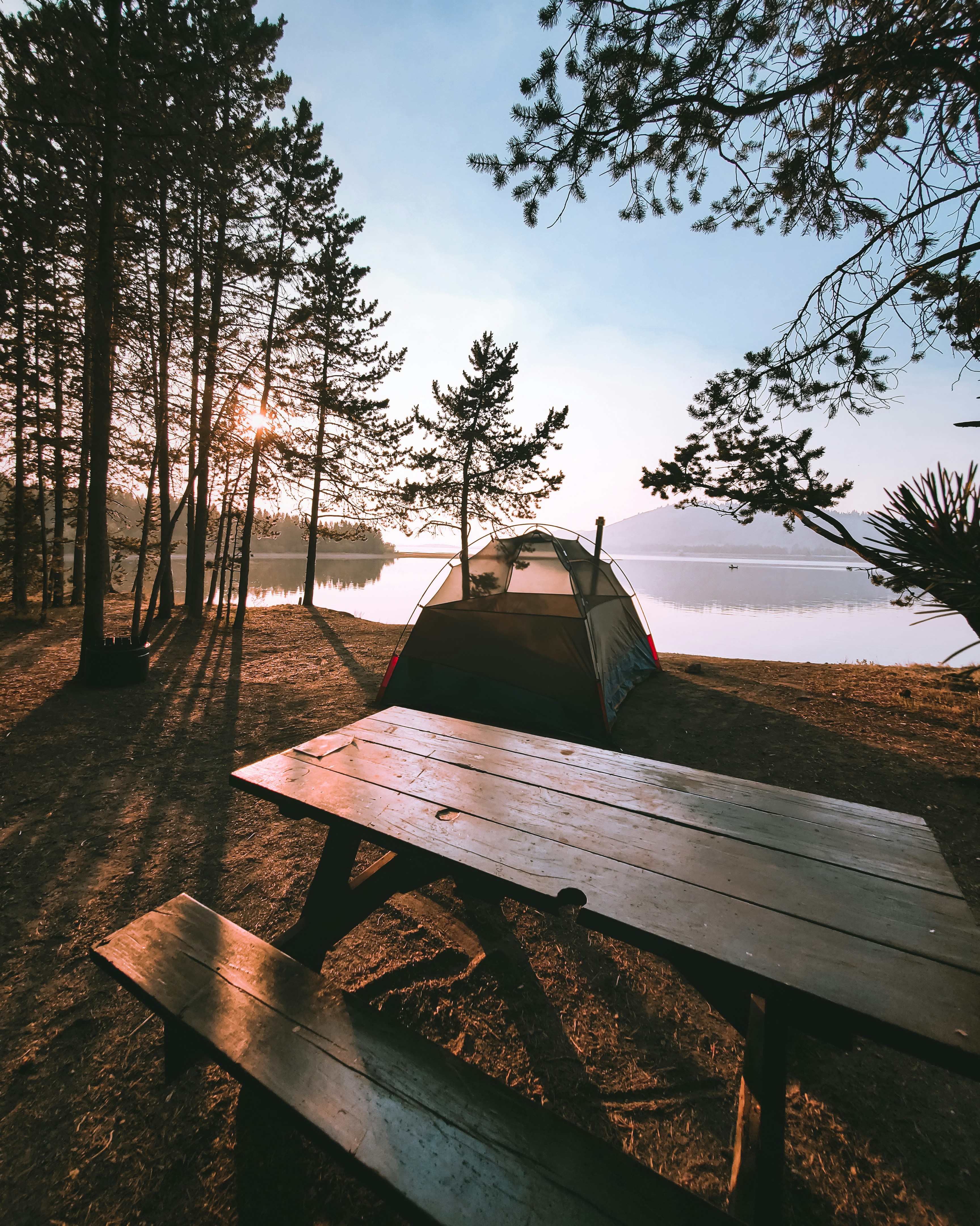Sunlit Campsite by the Quiet Lake at Dusk