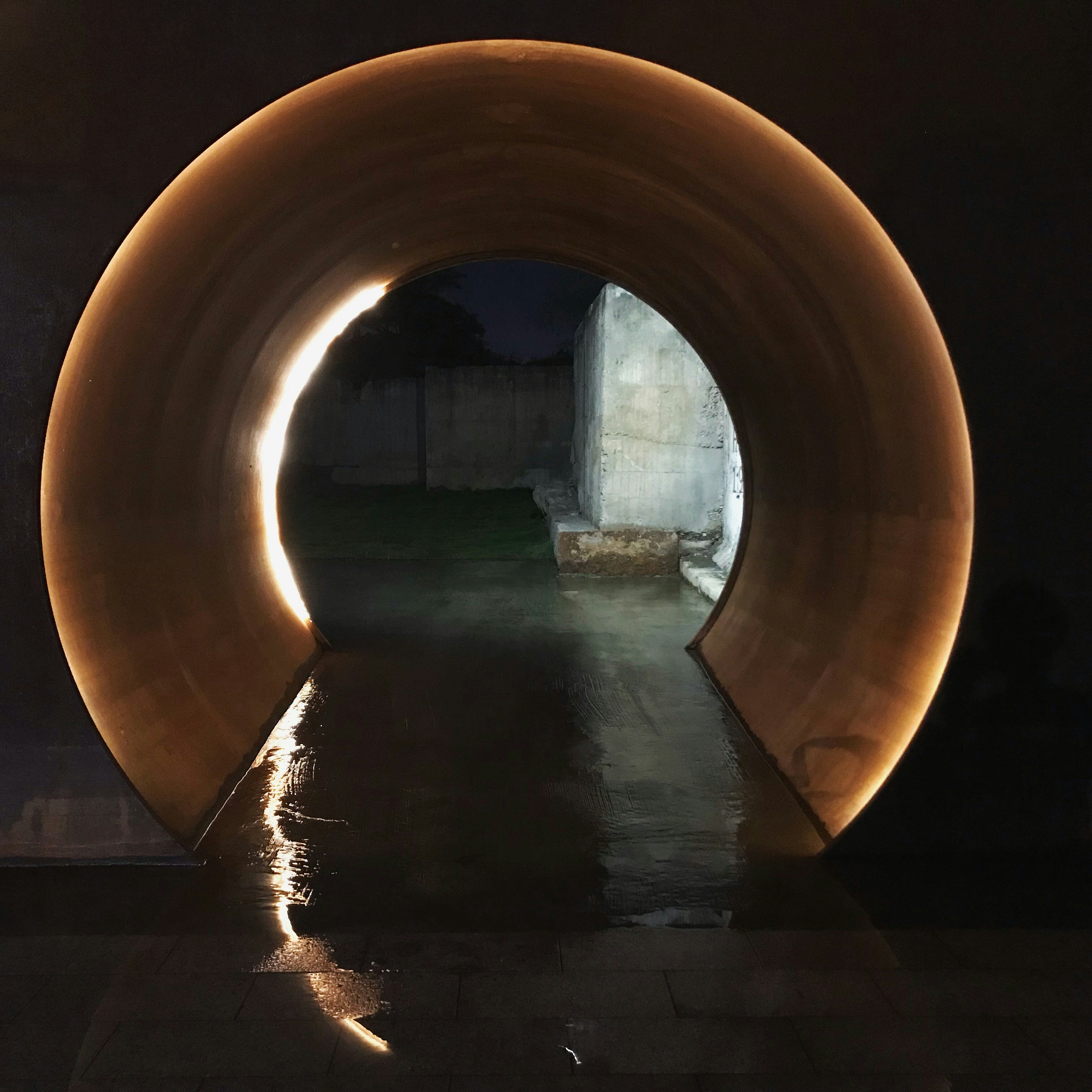 Glowing Ring Tunnel: Night Walk Through a Circular Portal