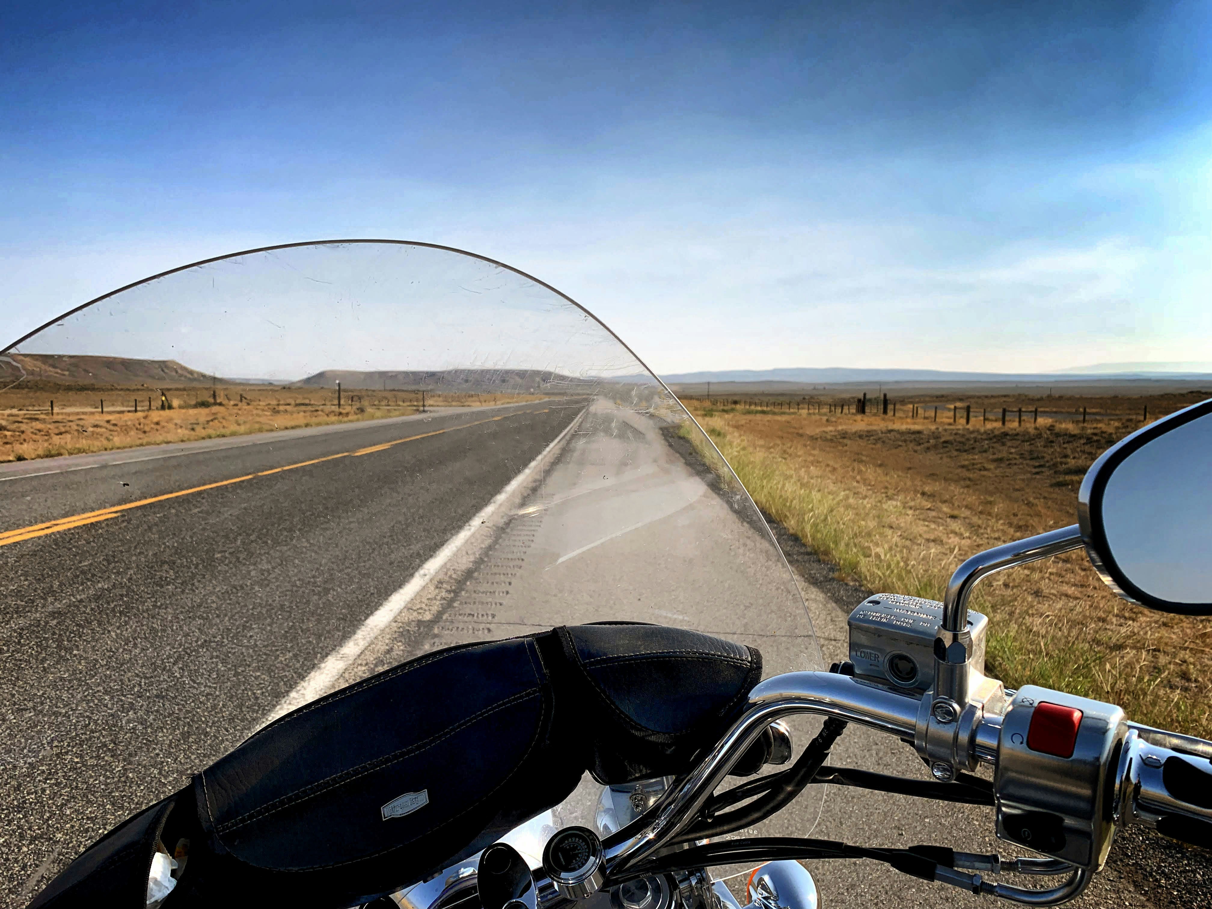 Wind-on-road: A chrome-mathed ride toward the endless horizon