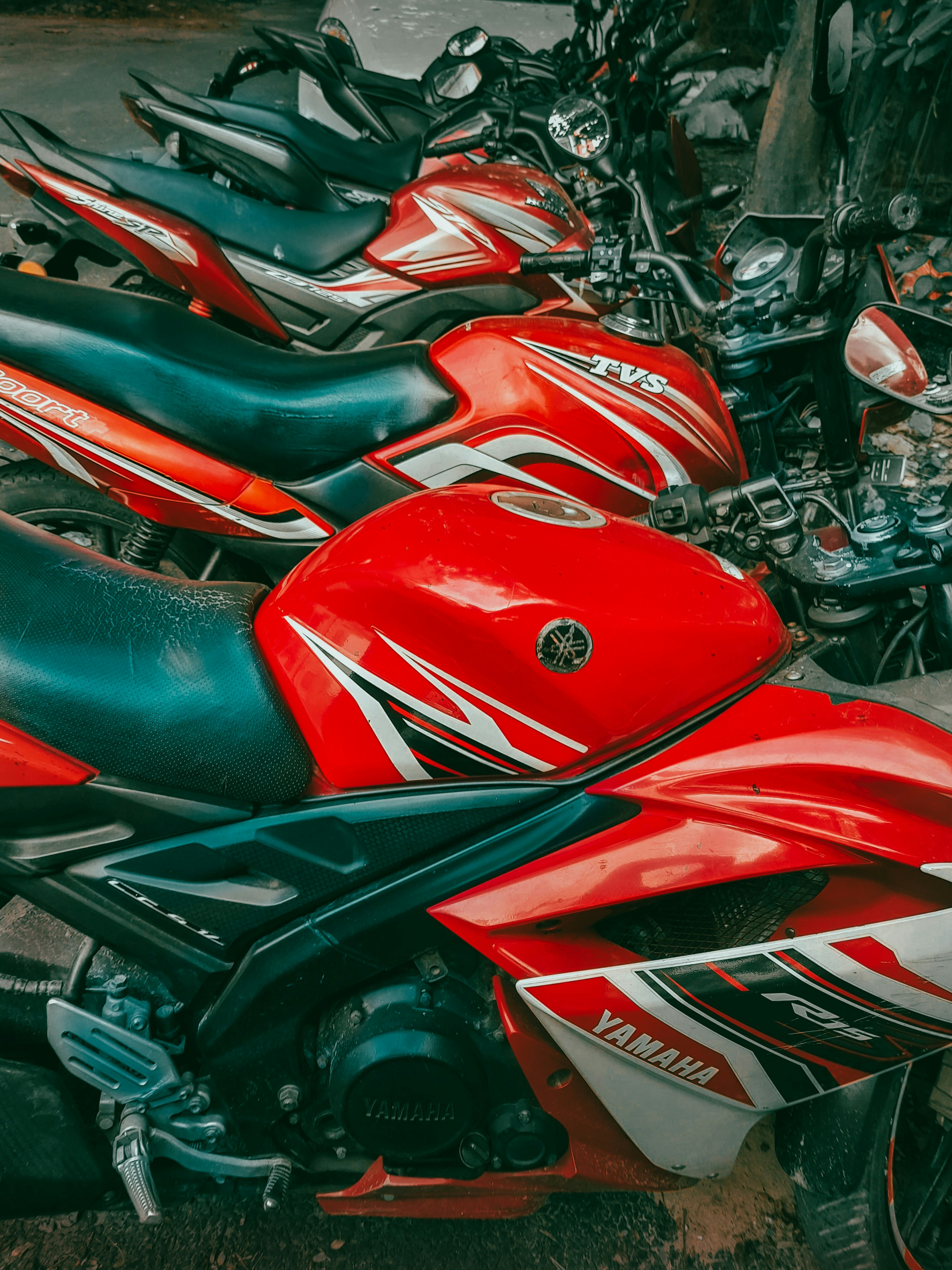 Tight Red Parade: Close-Quarters Yamaha sportbikes stacked in shade