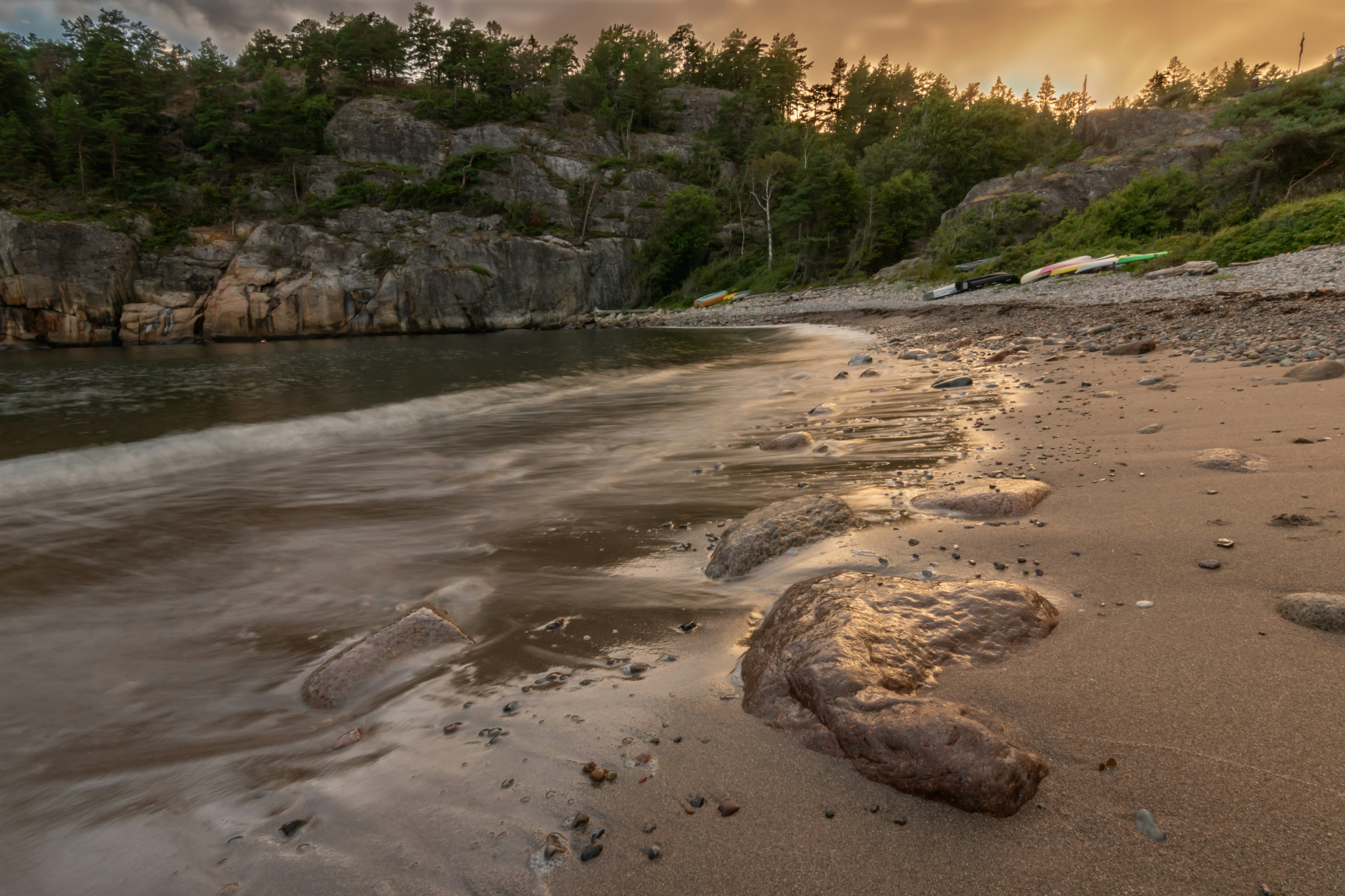 Pebble Path to Dusk: A Quiet Cove Between Sea and Pines