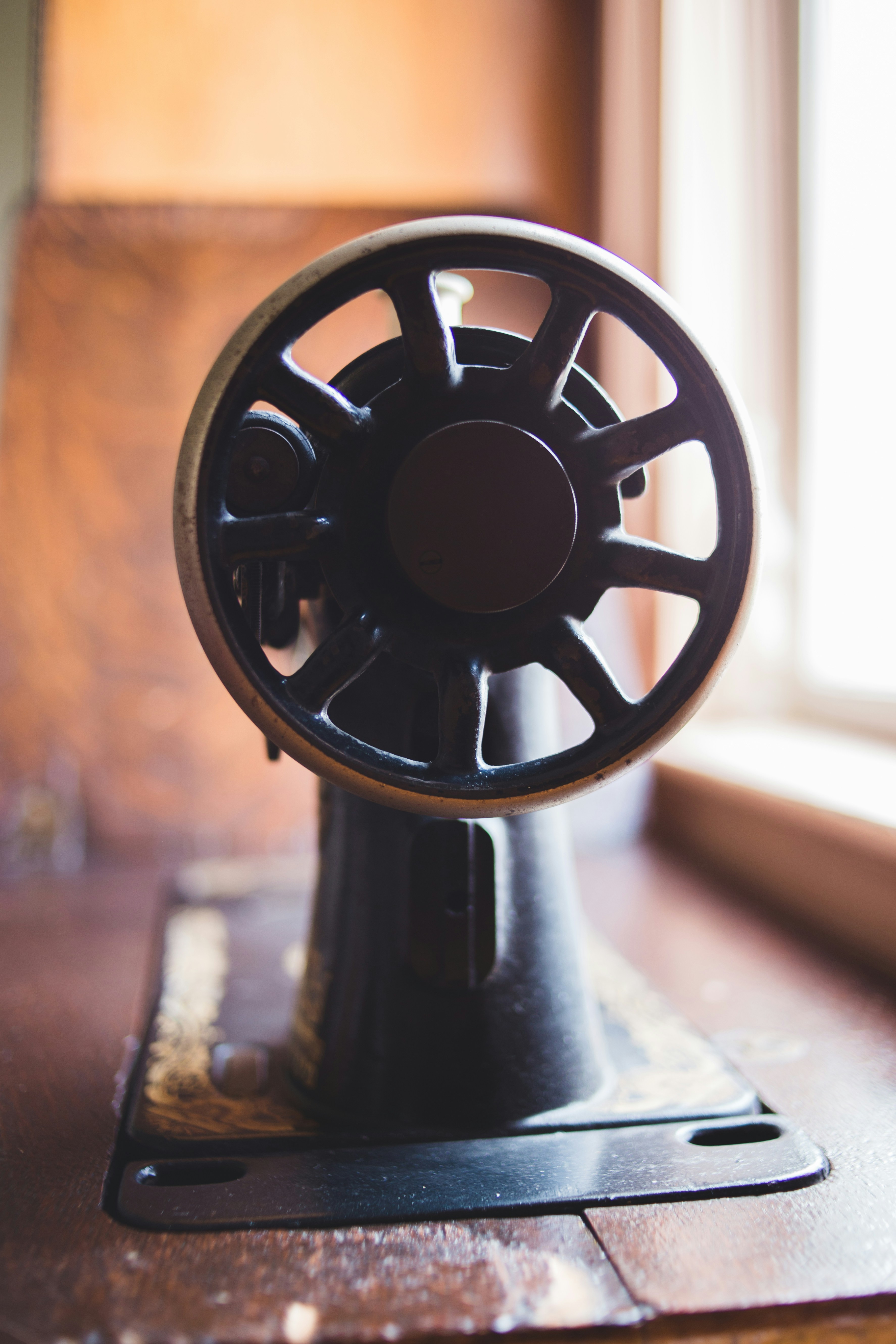 Turn of the Handwheel: A Close-Up Portrait of Vintage Craft in Soft Window Light