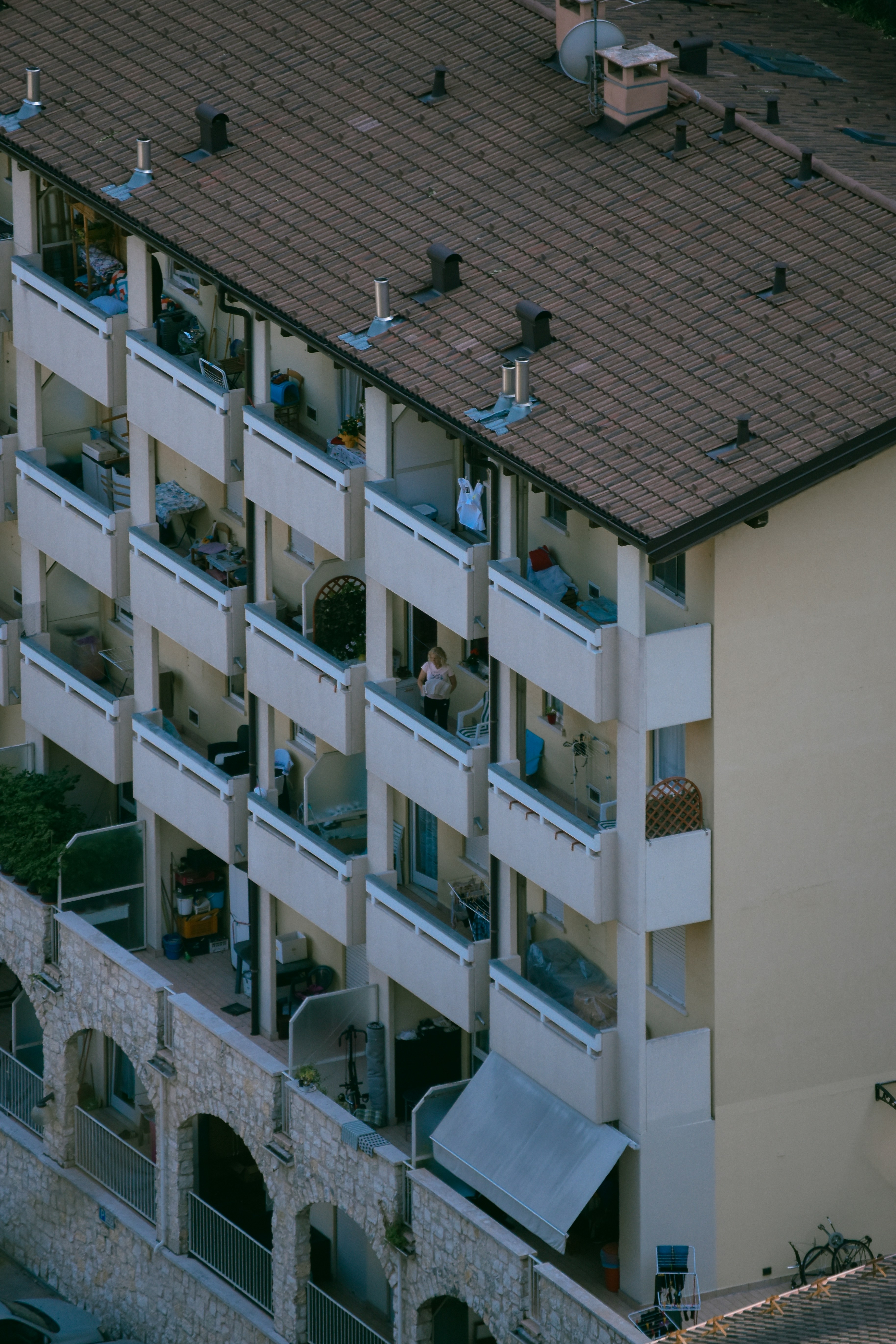 Vertical Terrace: Faces in a Distant Apartment Row